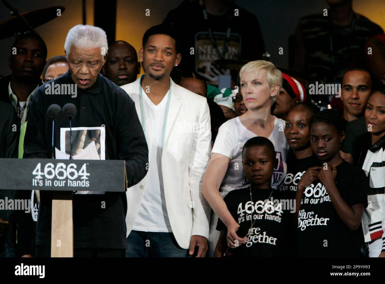 Nelson Mandela, left, speaks as from left U.S. actor Will Smith ...