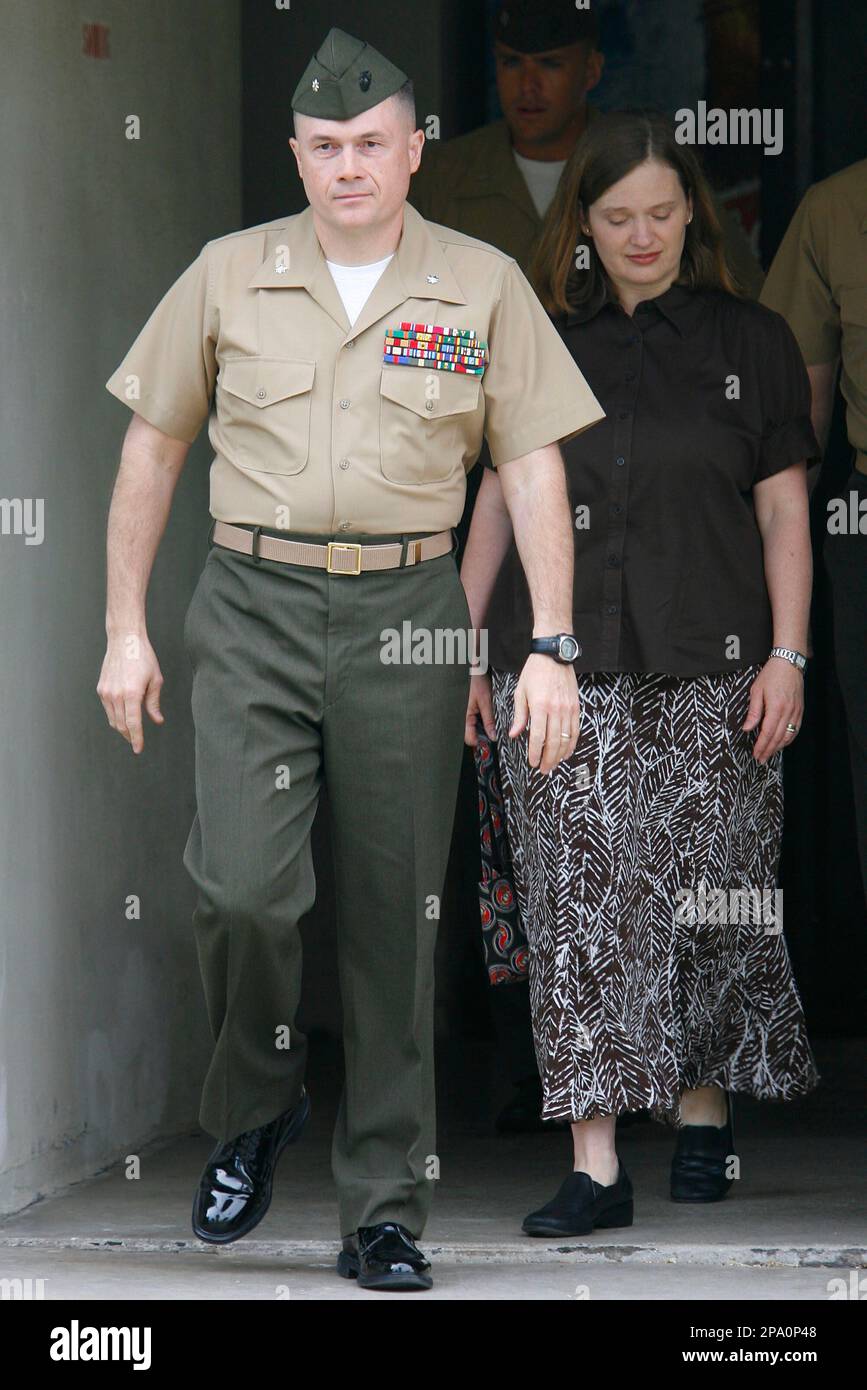 Marine Corps Lt. Col. Jeffrey Chessani, left, arrives with his wife ...