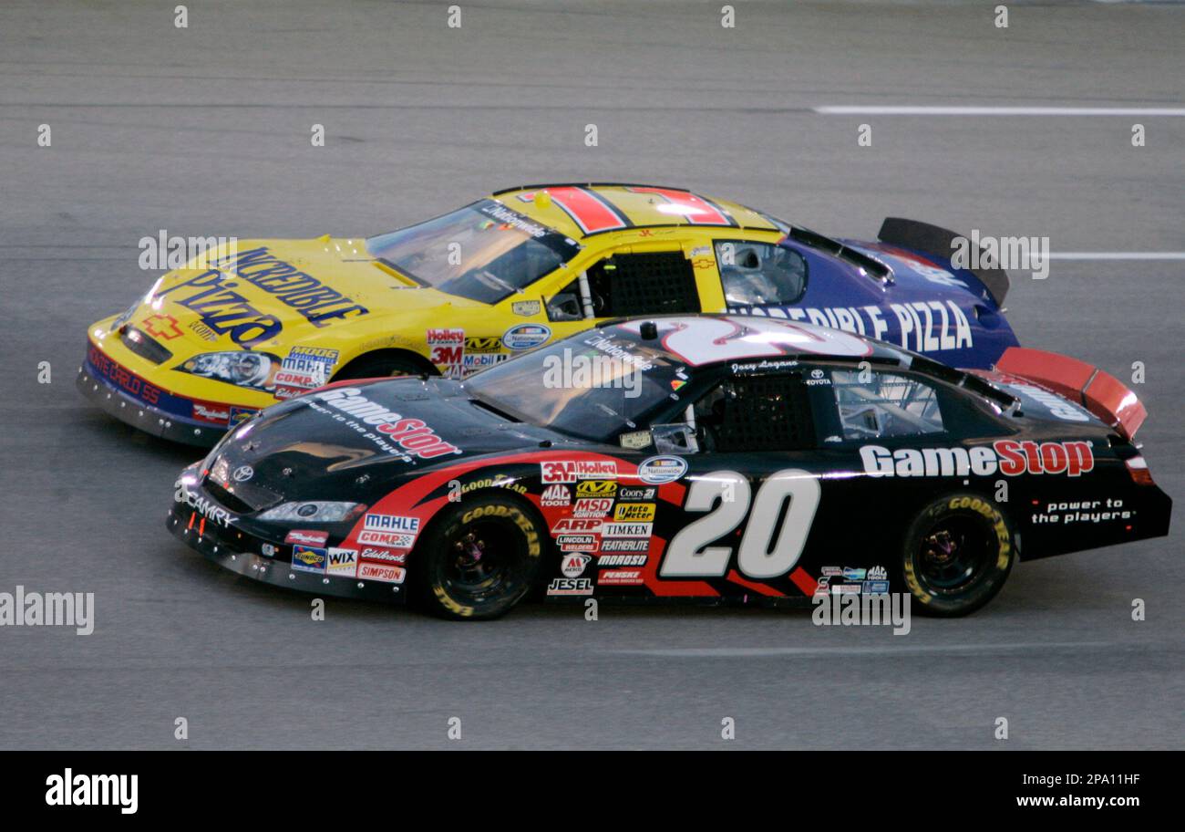 Pole-sitter Joey Logano (20) moves past Jason Keller to begin the ...