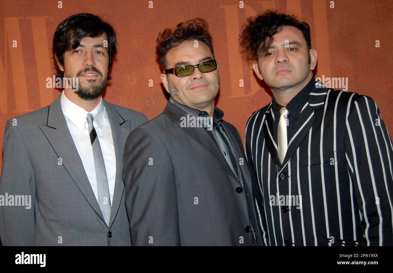 Members of the Mexican rock band Cafe Tacuba pose for photographers as ...