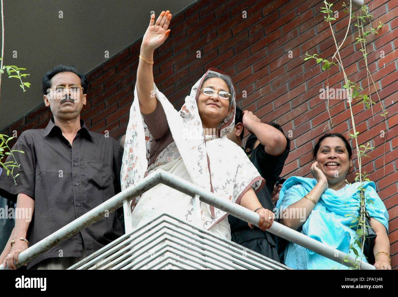 Former Bangladeshi Prime Minister Sheikh Hasina, center, waves to ...