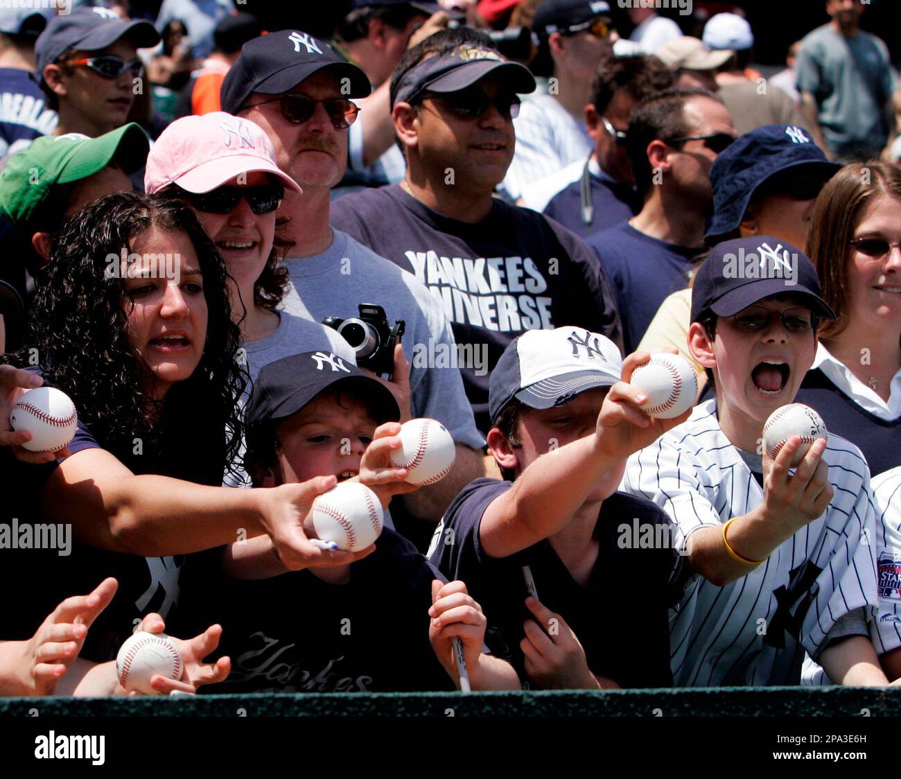 New York Yankees' fans try and get autographs before the start of a ...