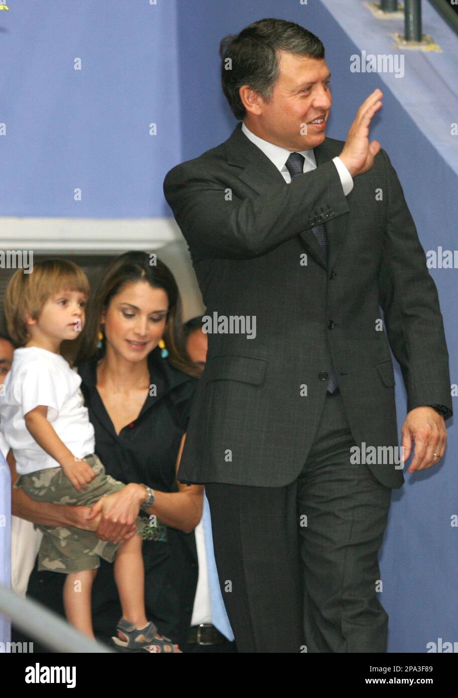 King Abdullah II of Jordan, right, and his wife Queen Rania, and their ...