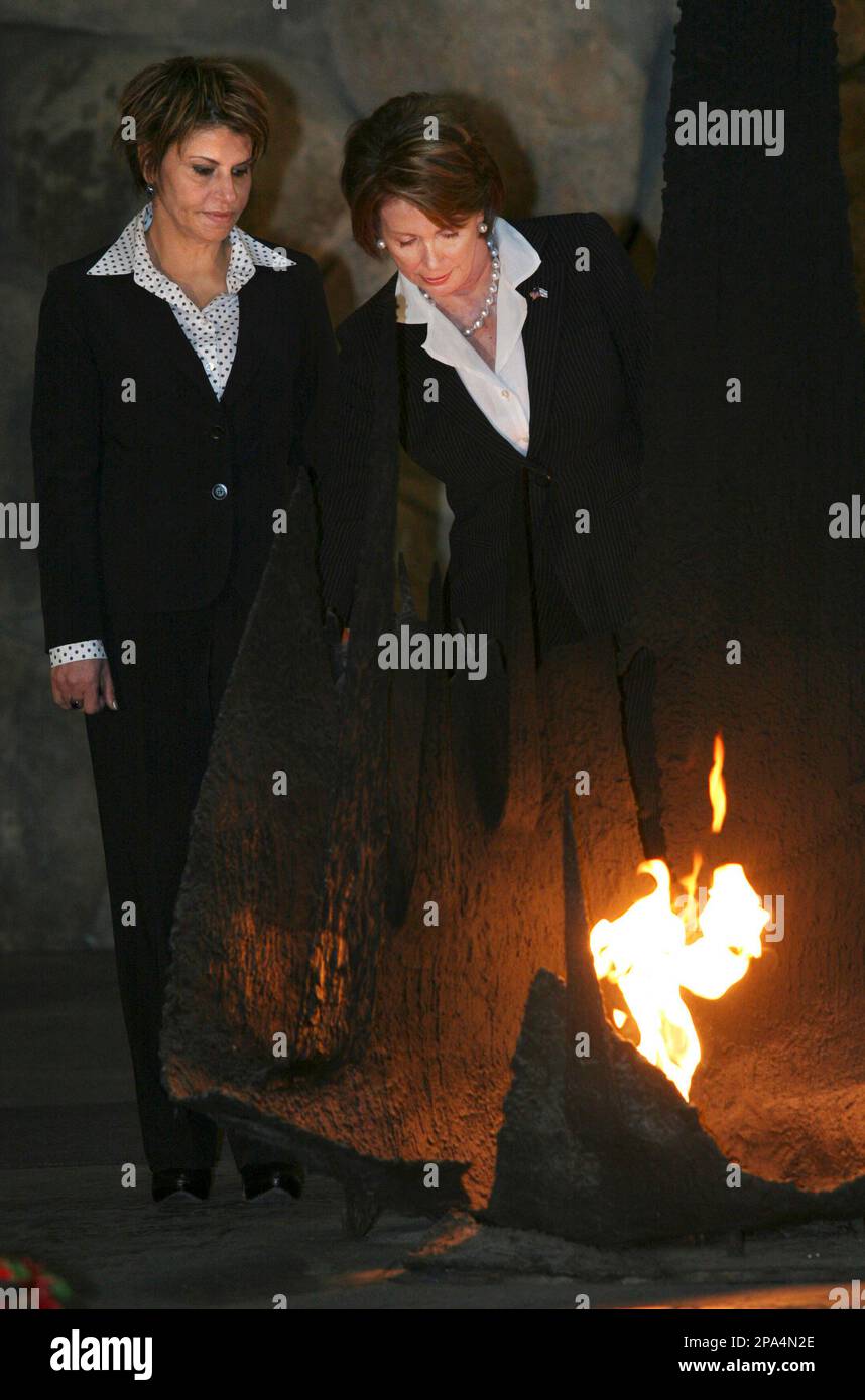 U.S. House Speaker Nancy Pelosi, right, rekindles the Eternal Flame, as ...