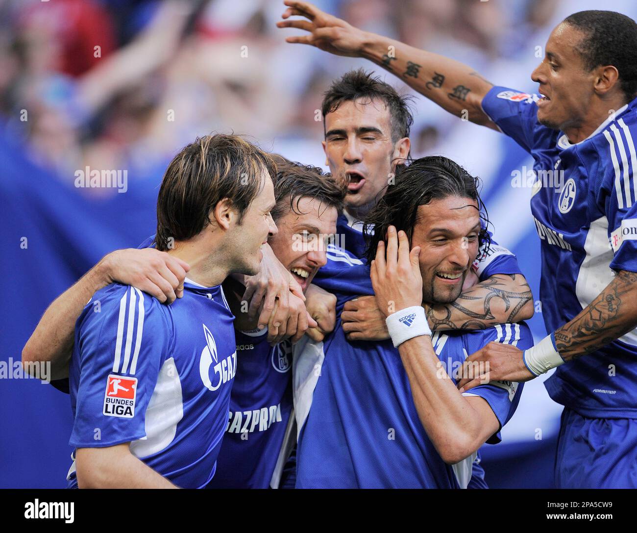Schalke's Heiko Westermann, scorer Mladen Krstajic, Vicente Sanchez ...