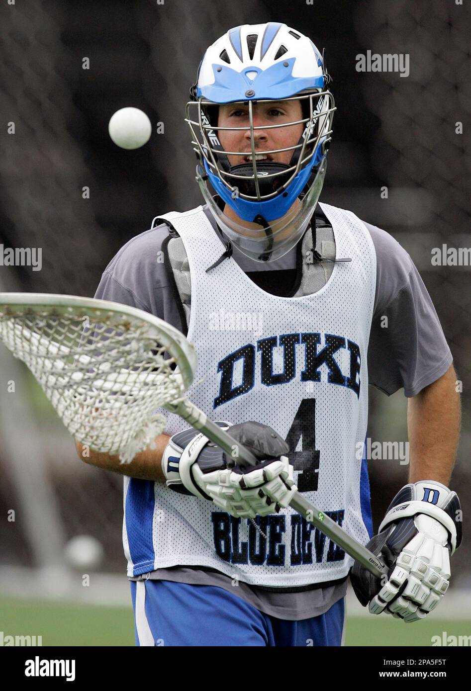 Duke lacrosse goalie Dan Loftus tosses the ball during practice in ...