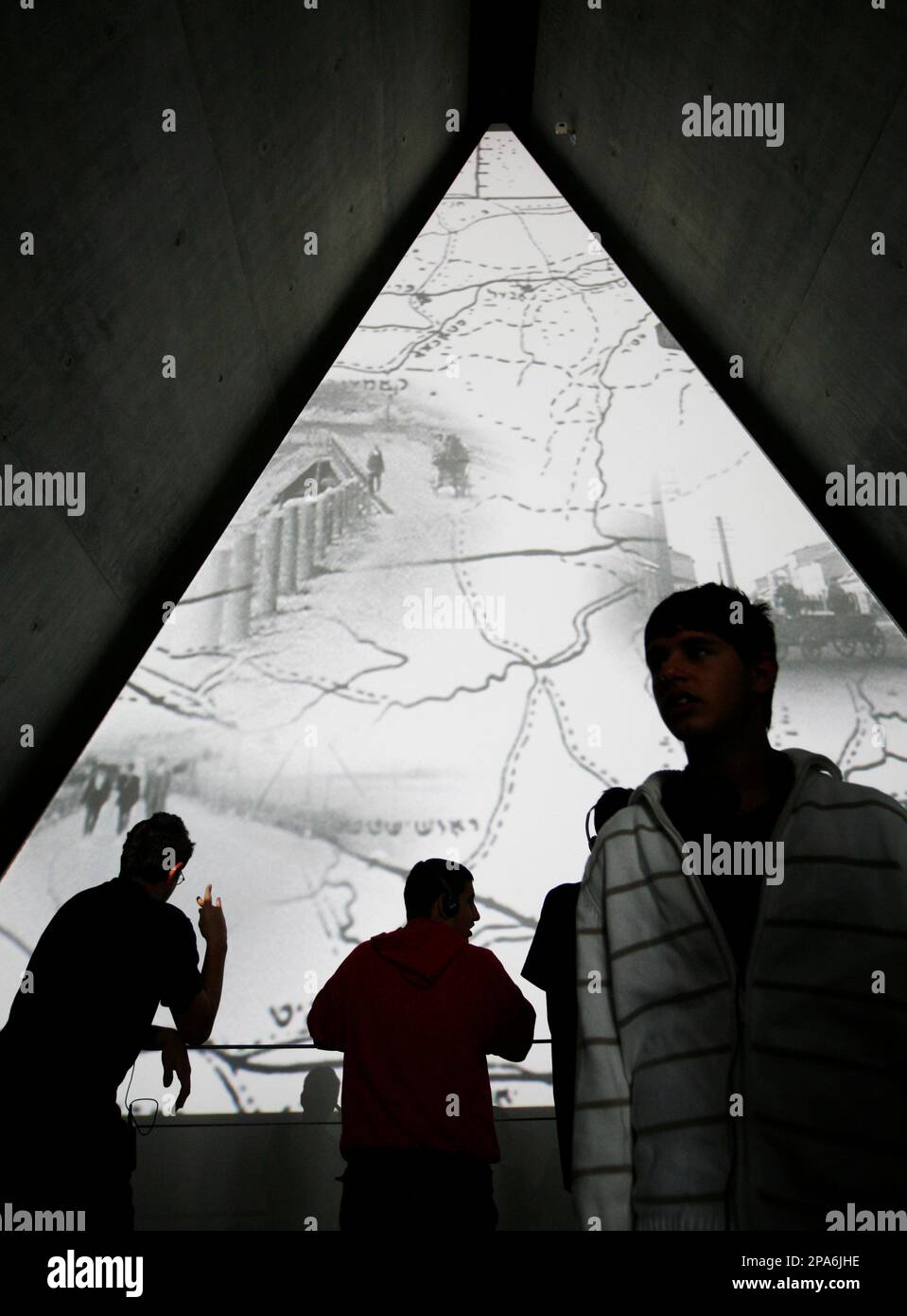 Visitors walk through an exhibit at the Yad Vashem Holocaust Memorial ...