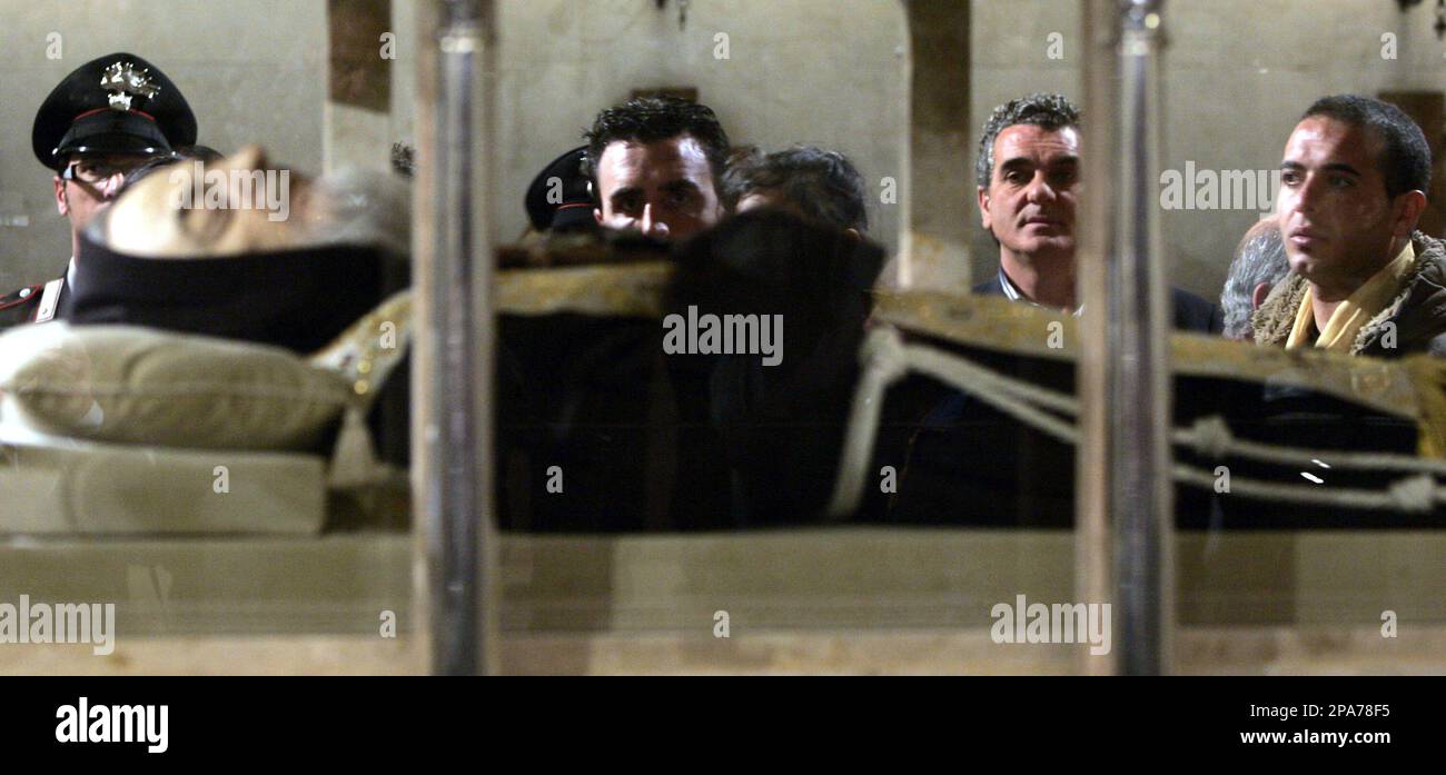 Pilgrims view the body of Padre Pio, an Italian saint, laying in repose ...