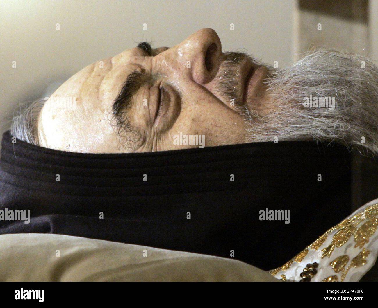 A silicon hand-painted bearded mask of the face of Padre Pio, an ...
