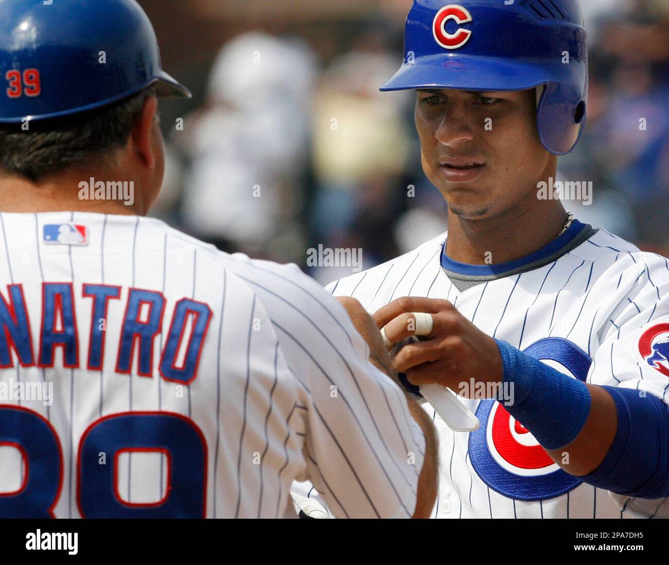 Chicago Cubs' Ronny Cedeno, right, celebrates with first base coach ...