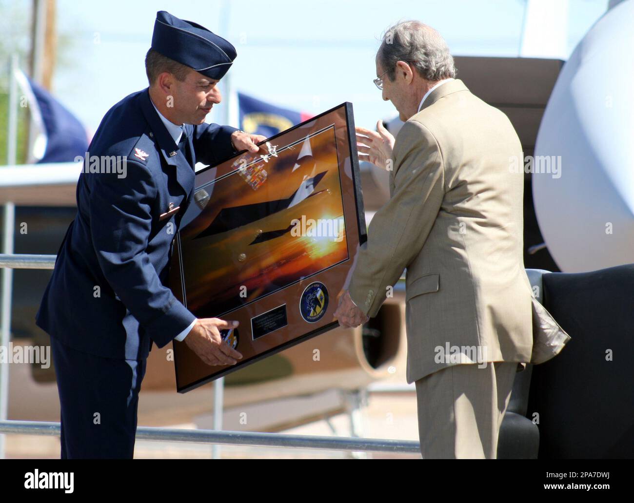 From left, 49th Fighter Wing Commander Col. Jeffrey Harrigian presents ...