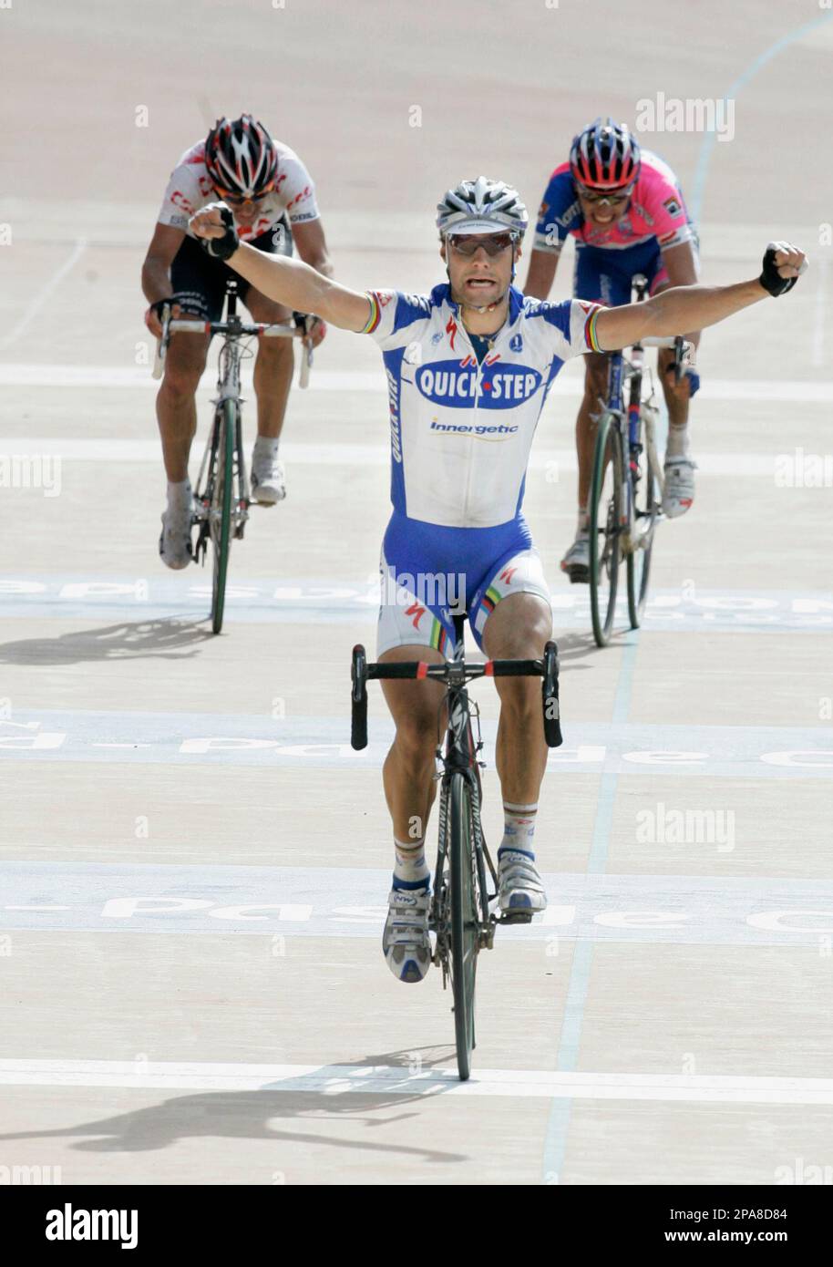 Belgium's Tom Boonen of the Quick Step team jubilates as he wins the ...