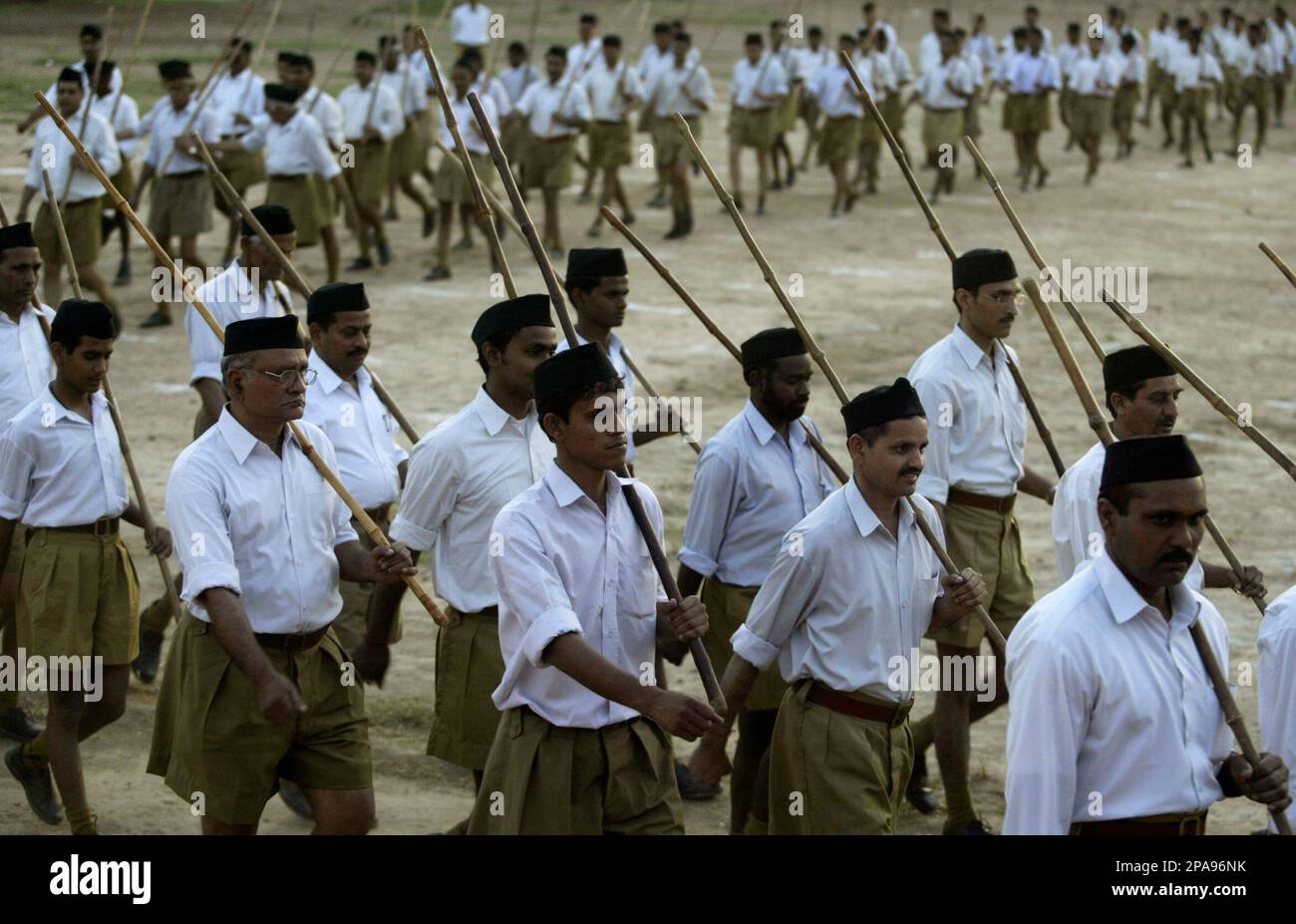 Rashtriya Swayamsevak Sangh volunteers march past on the eve of Vikram ...