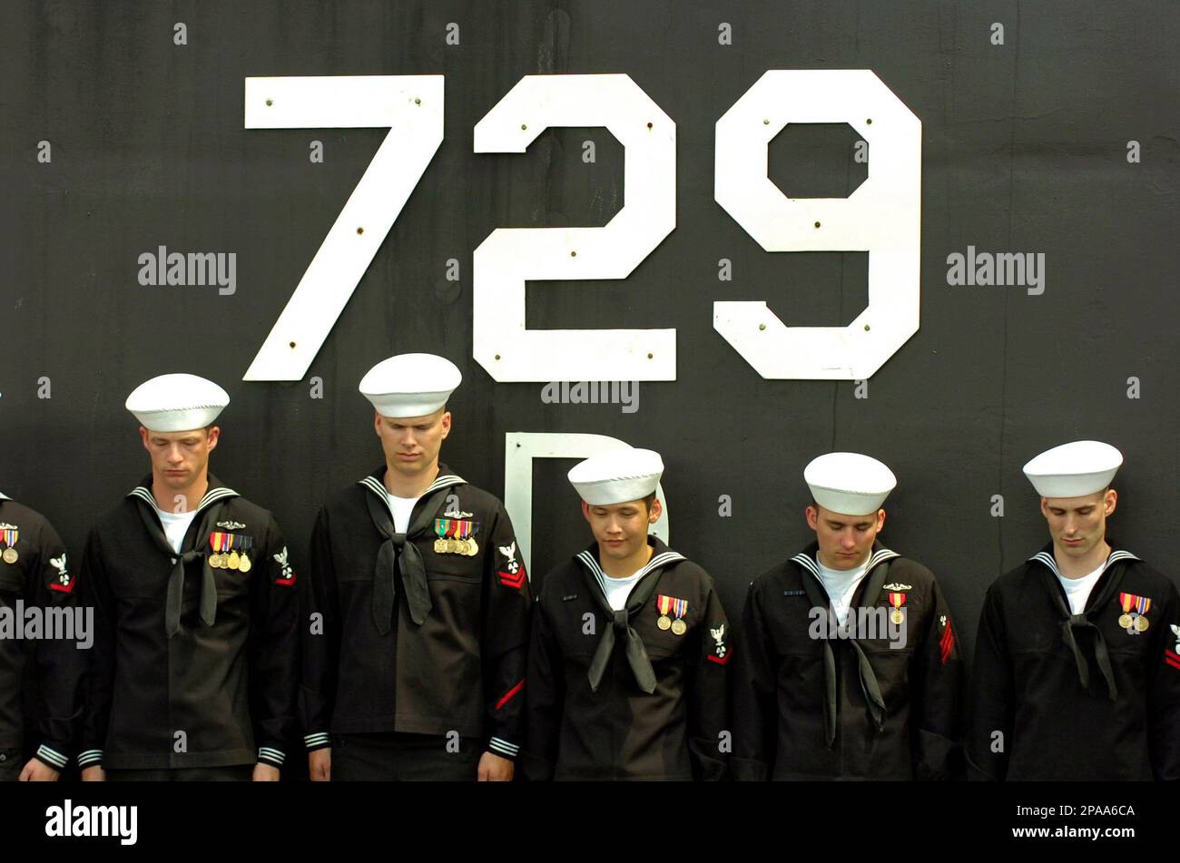 The crew of the U.S. Navy's nuclear-powered submarine USS Georgia bow ...
