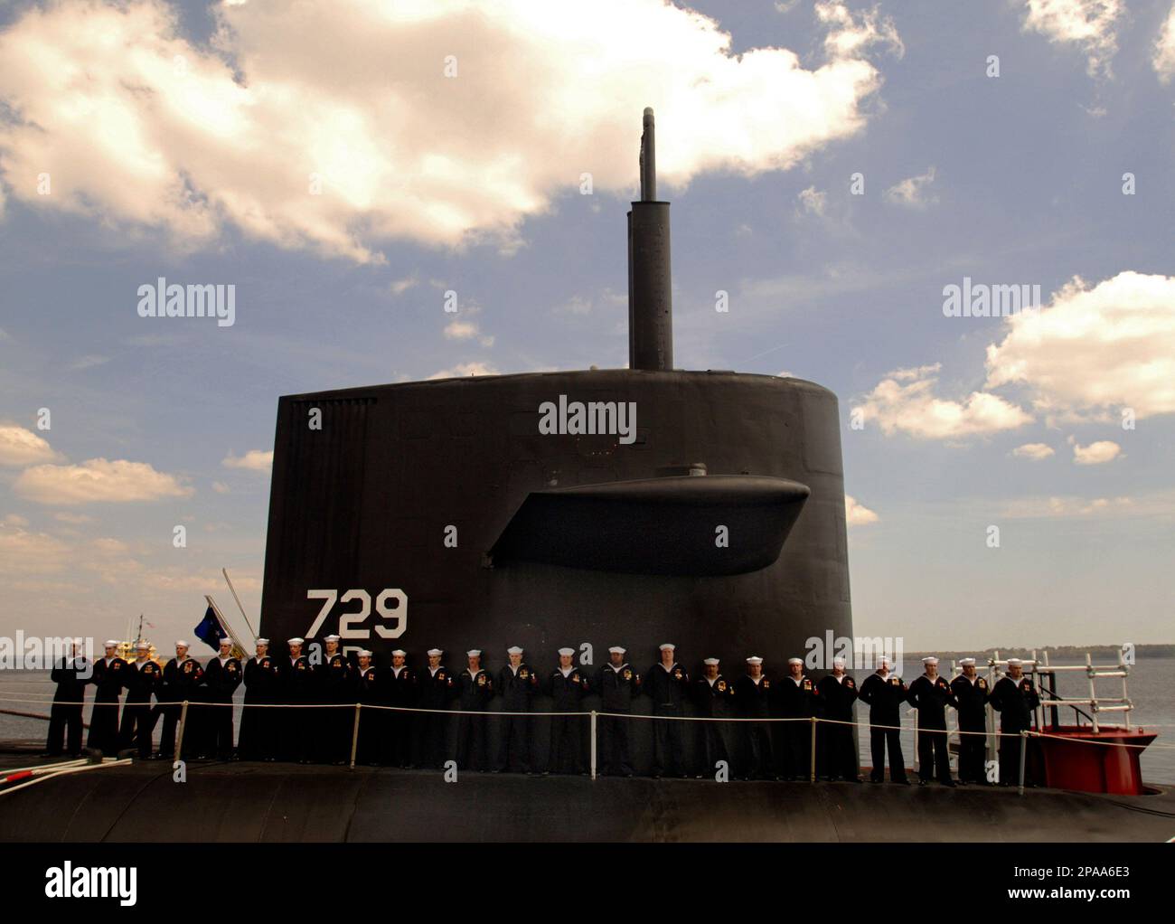 The crew of the U.S. Navy's nuclear-powered submarine USS Georgia stand ...