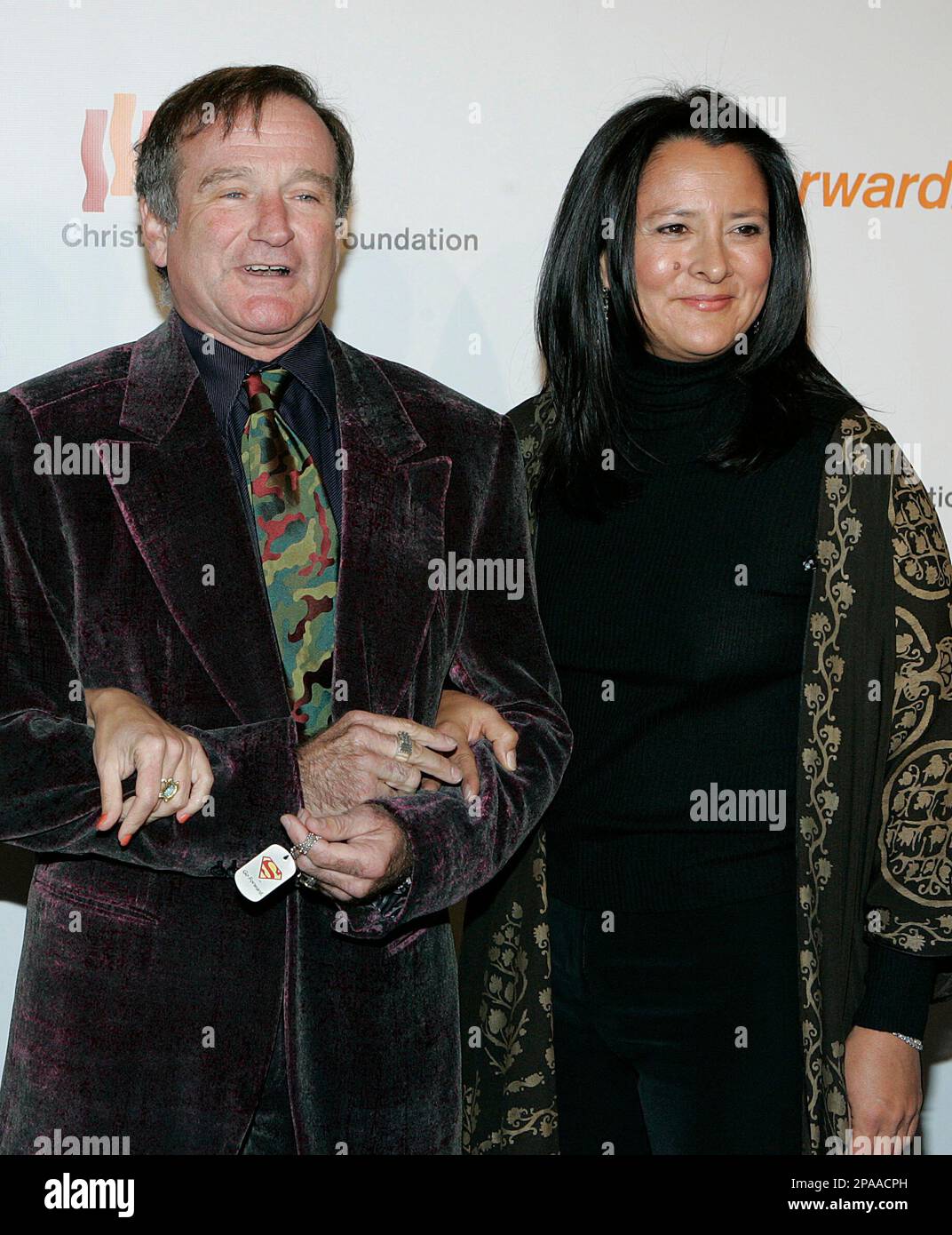 ** FILE ** Robin Williams laughs with his wife Marsha Garces Williams ...