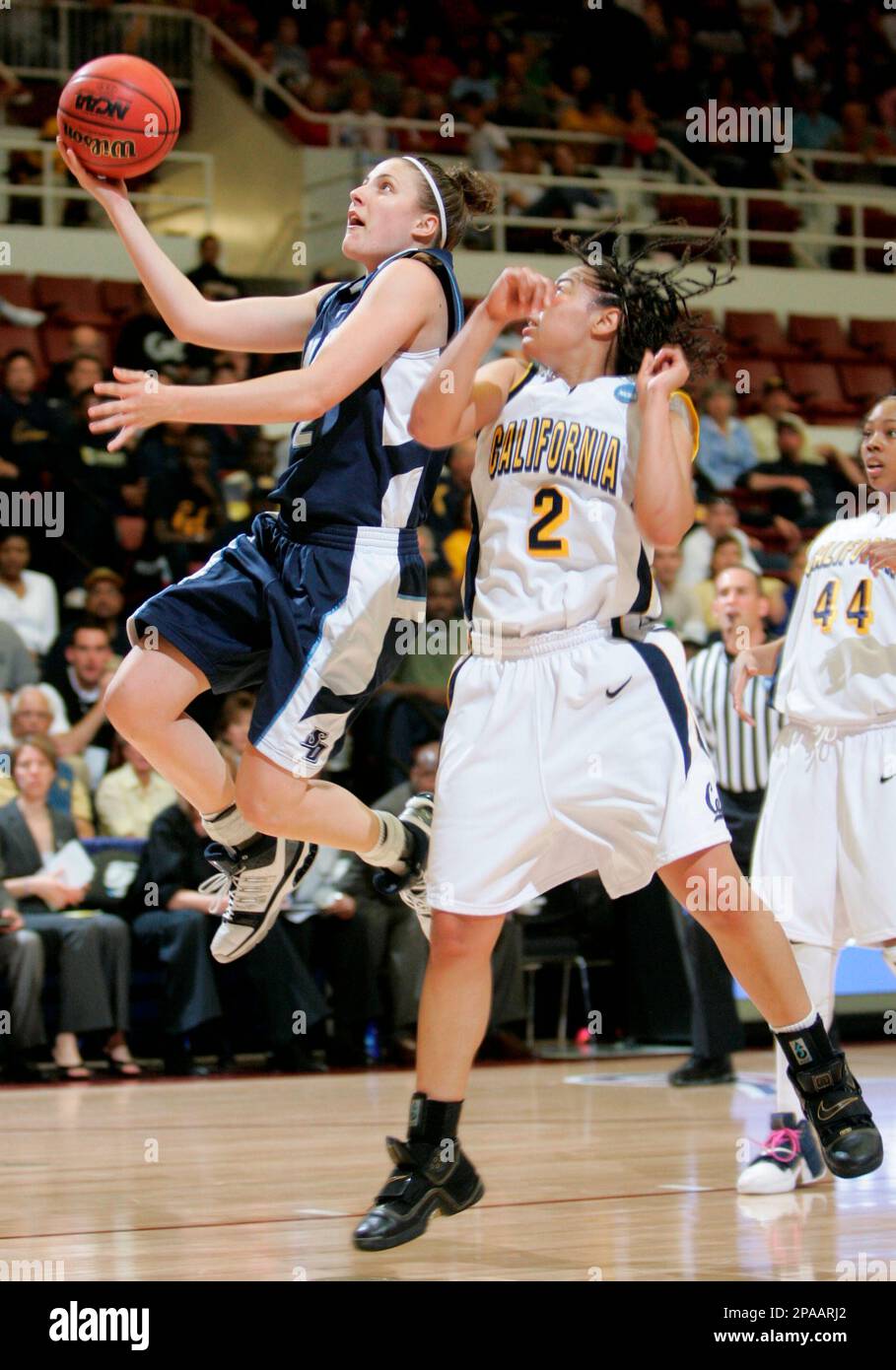 San Diego's Amanda Rego, left, scores past California's Natasha Vital ...
