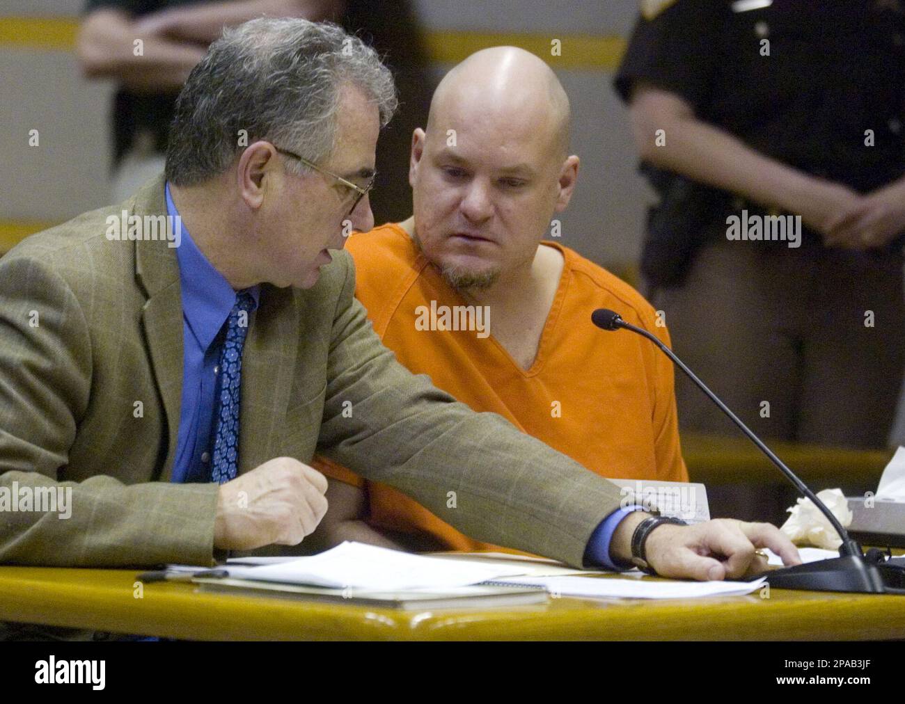 James A. Hole listens to his attorney John Rhiel during his arraignment ...