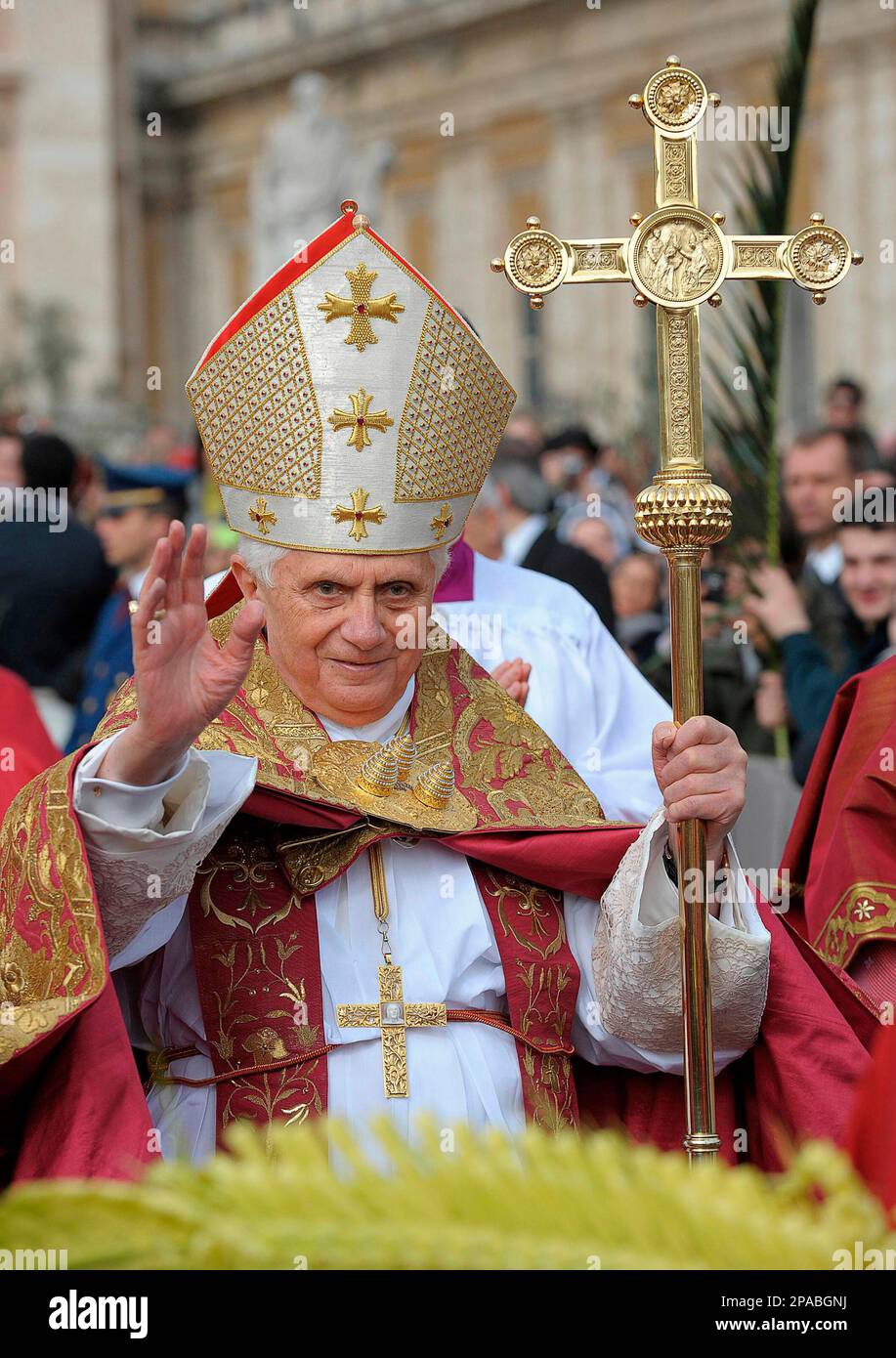 Pope Benedict XVI holds the papal staff while leading a procession ...