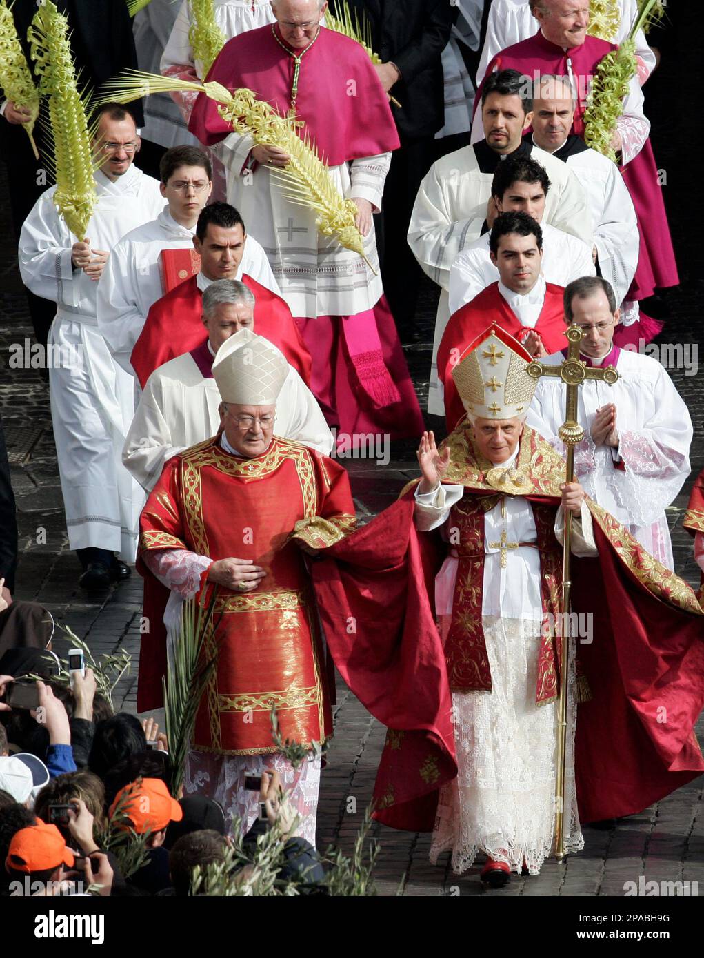 Pope Benedict XVI holds his papal staff as he walks in procession prior ...