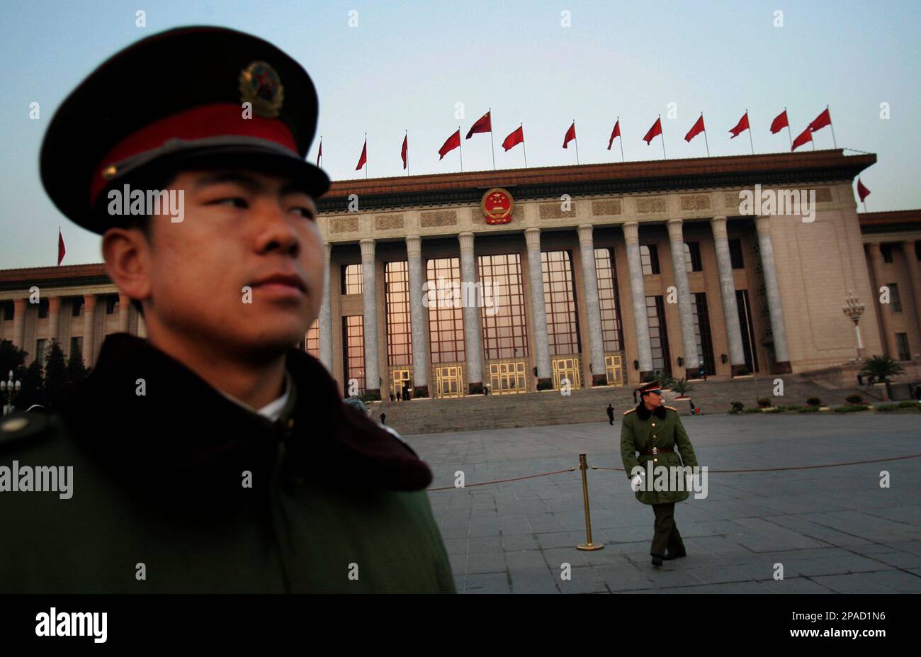 Chinese paramilitary officers stand on duty in front of the Great Hall ...