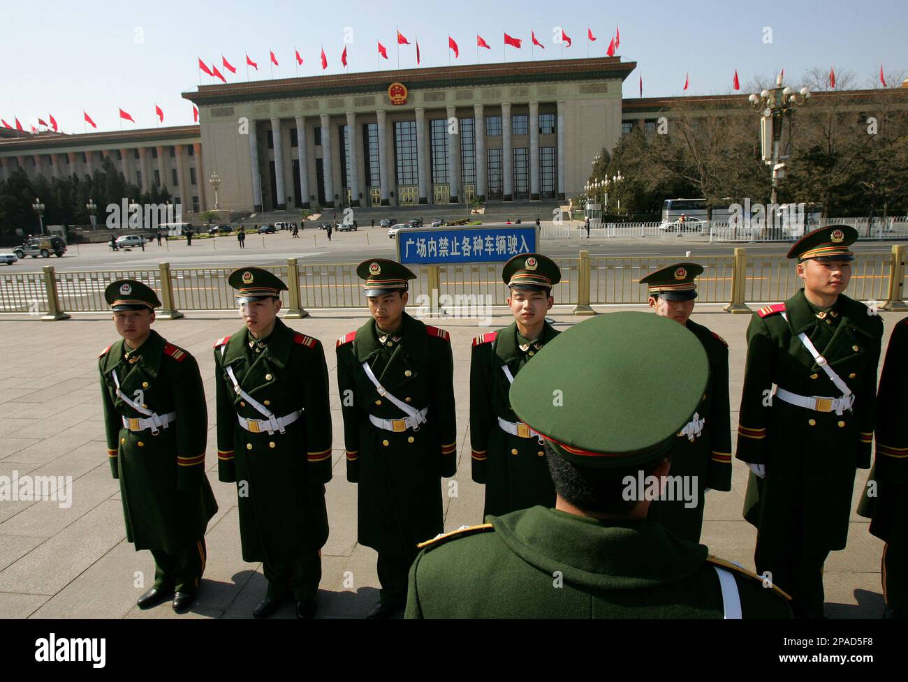 Chinese paramilitary police officers prepare for a patrol in Beijing's ...