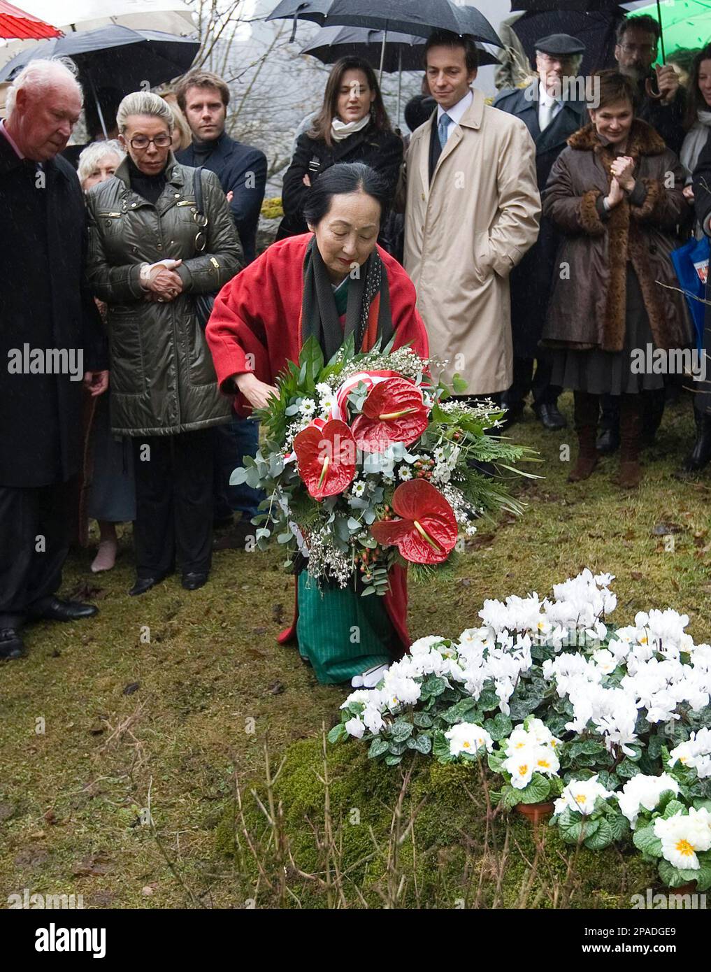 Balthus' wife Setsuko Klossowska de Rola lays down flowers during a ...