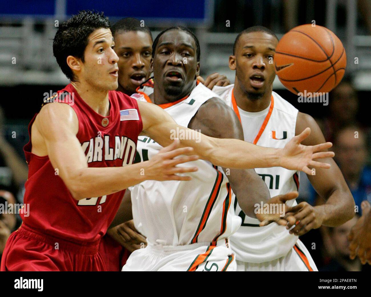 Maryland guard Greivis Vasquez, left, tries to control a loose ball as ...