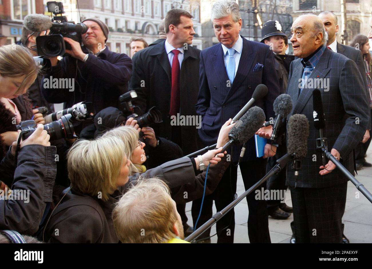 Mohamed Al Fayed speaks to media as he arrives at the High Court in ...