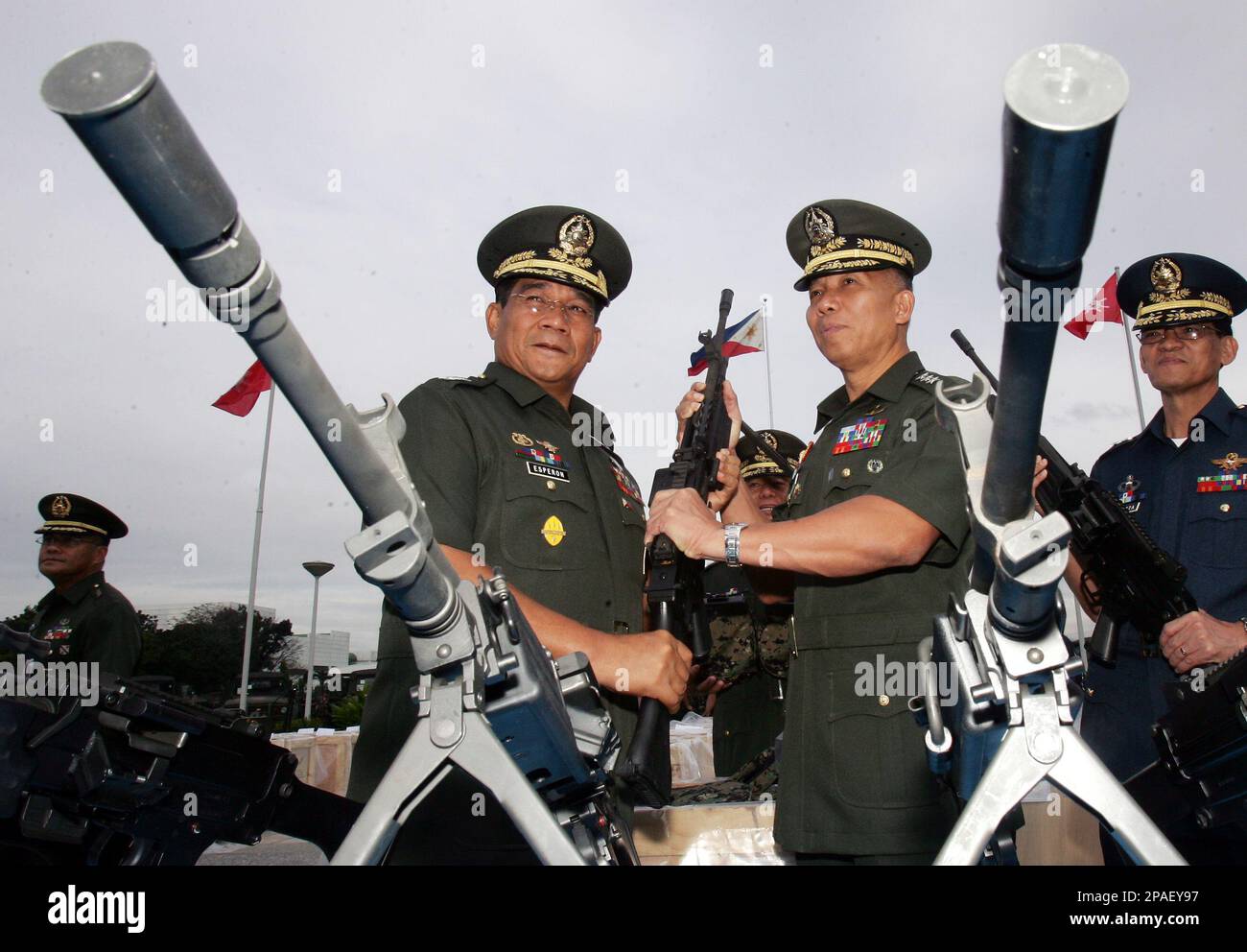 Philippine Armed Forces Chief Gen. Hermogenes Esperon Jr., left, hands ...