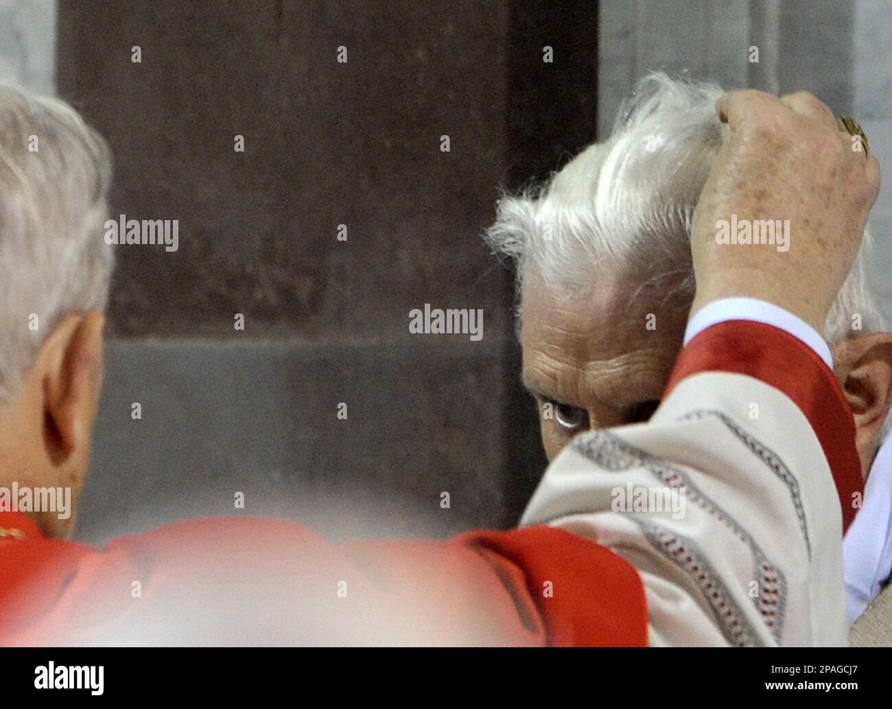 Cardinal Josef Tomko, left, signs Pope Benedict XVI forehead with a ...