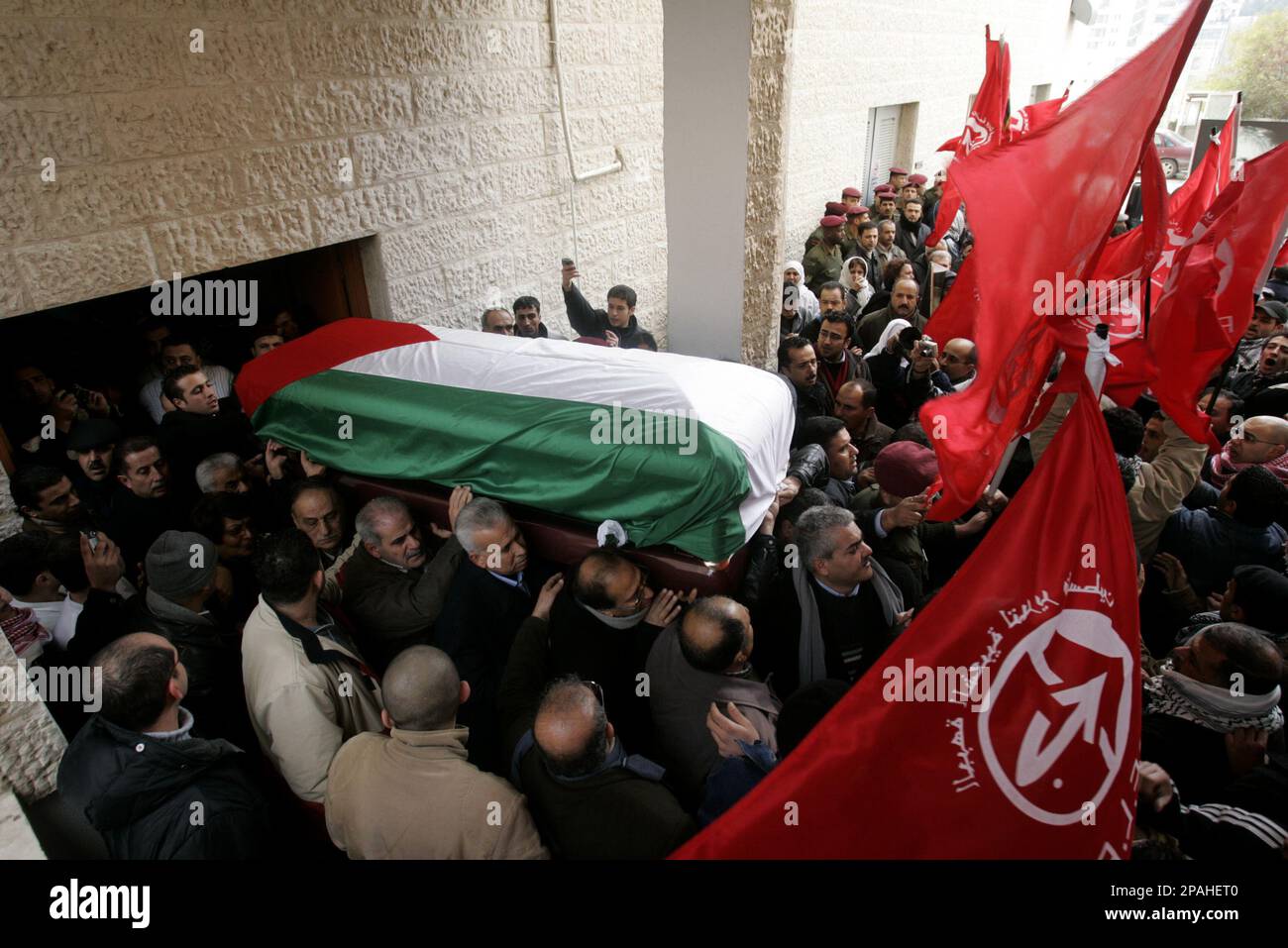 Mourners carry the coffin of George Habash, founder of the Popular ...