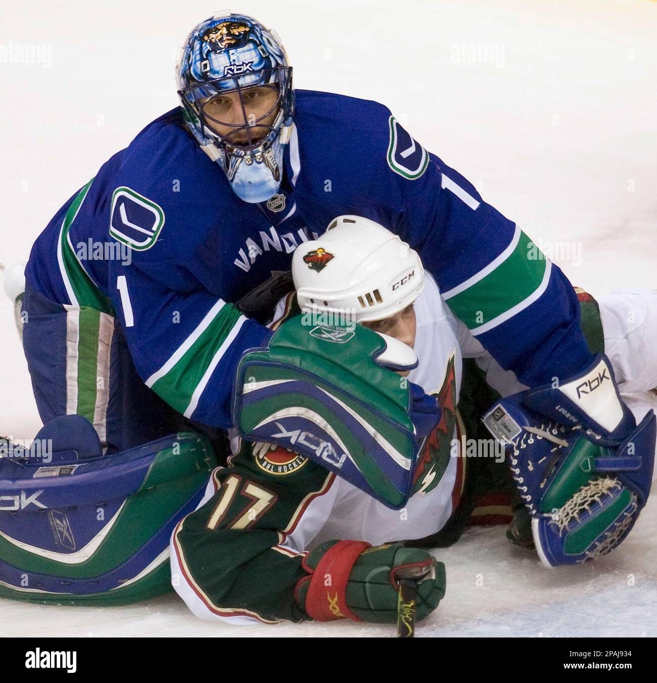Minnesota Wild's Todd Fedoruk slides into Vancouver Canucks goalie ...