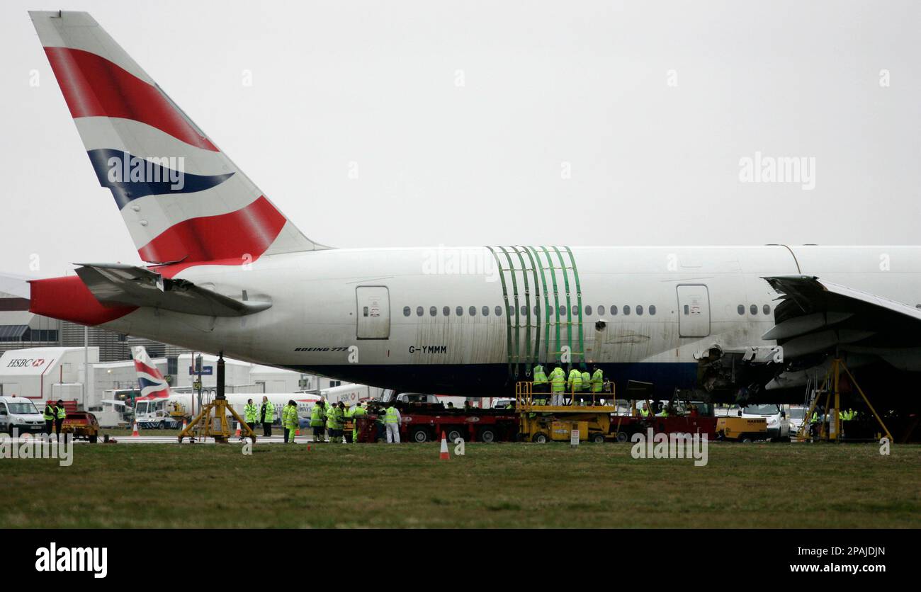 Workers at London's Heathrow airport, Sunday, Jan. 20, 2008, prepare to ...
