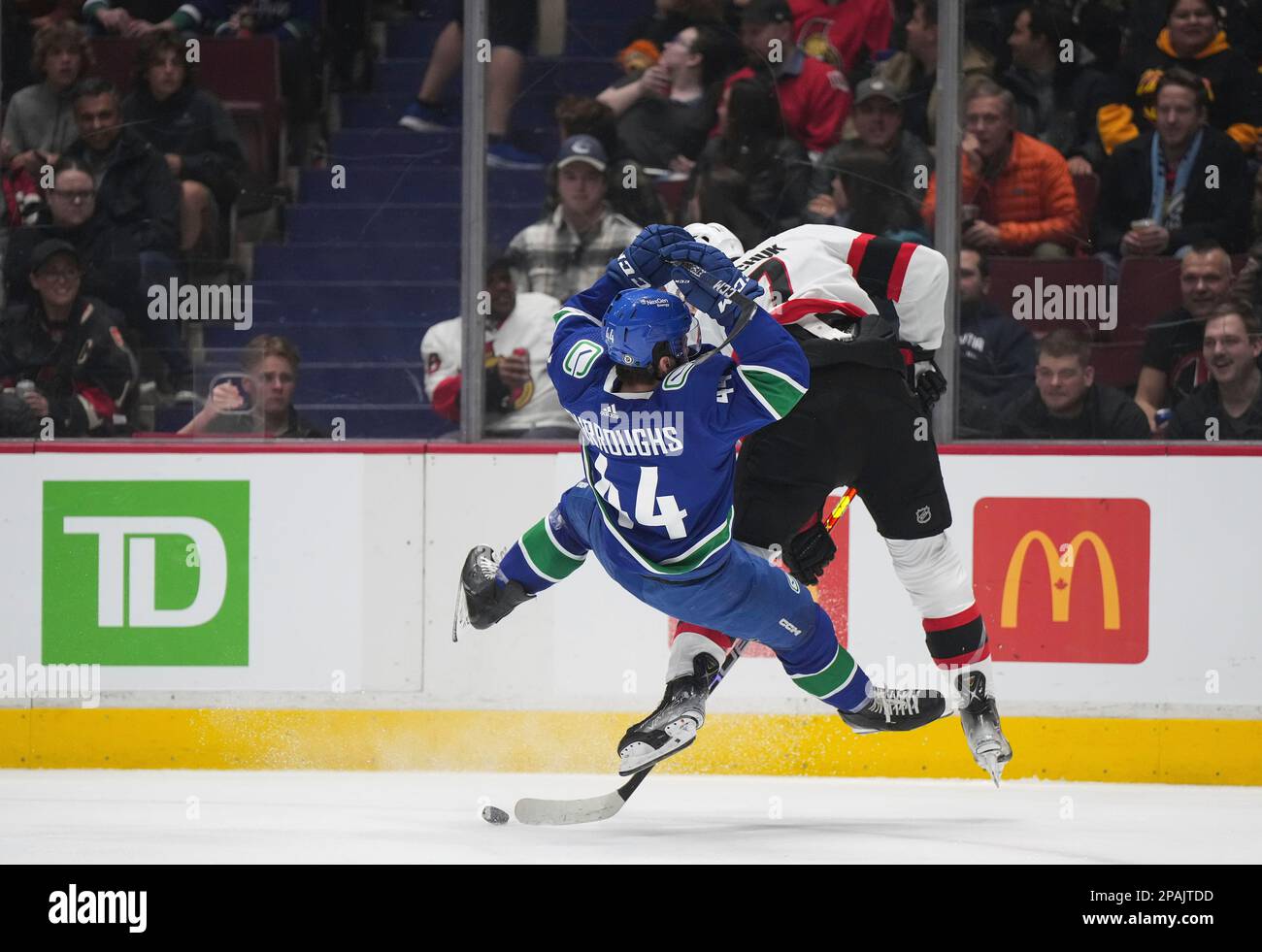 Vancouver Canucks' Kyle Burroughs (44) and Ottawa Senators' Brady ...