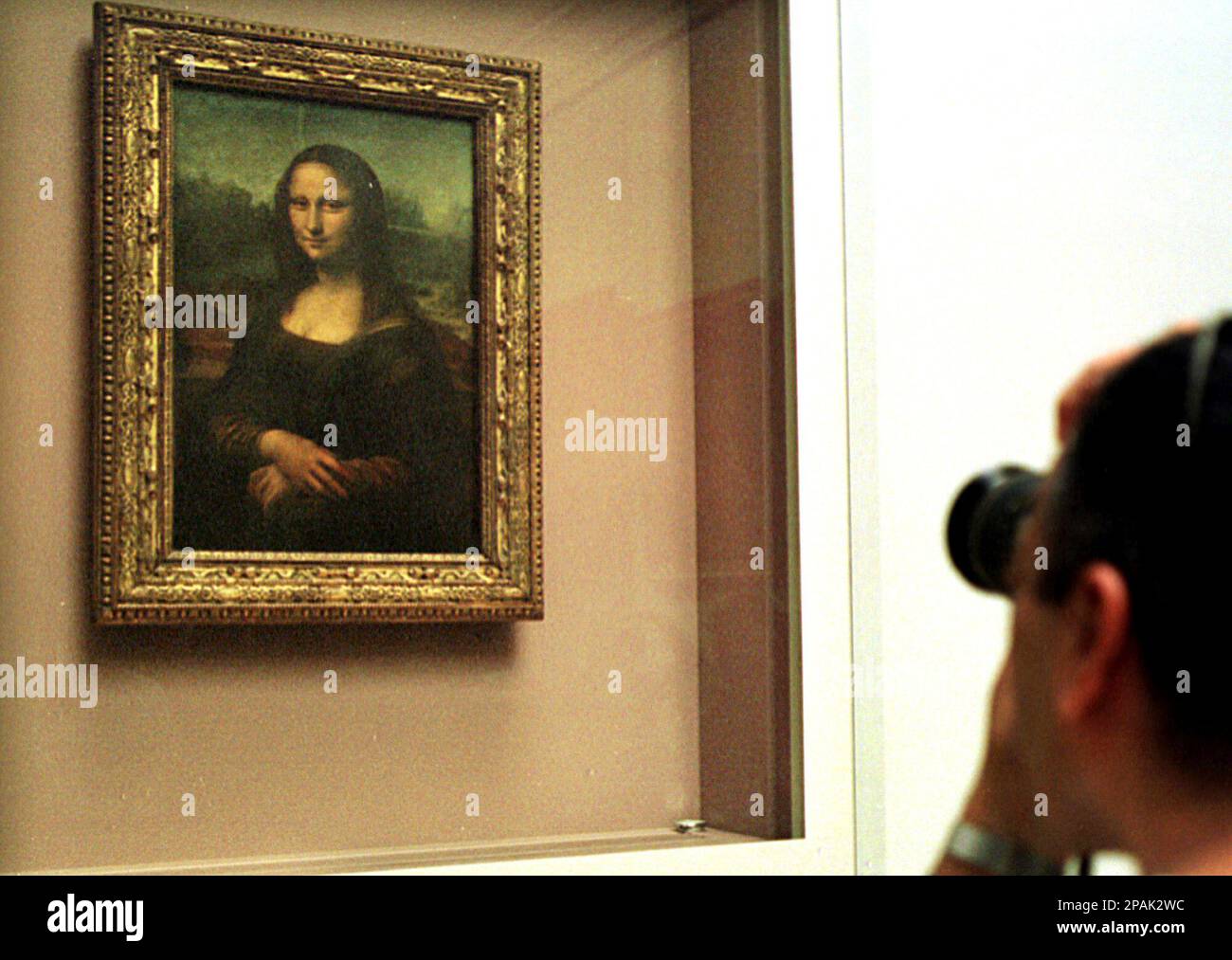 ** FILE ** A man takes a photograph of Leonardo da Vinci's 16th century ...