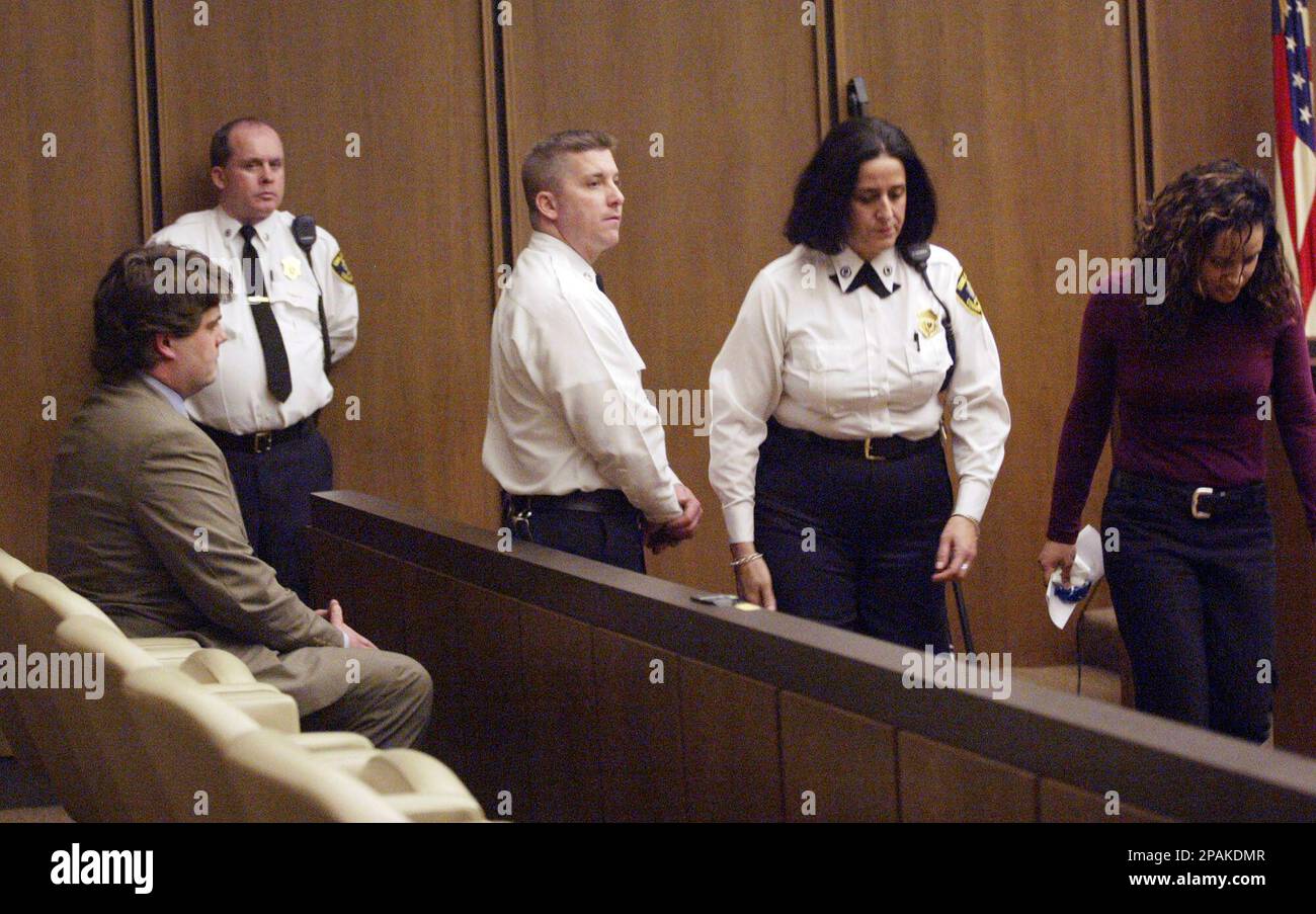 Desmarias Colono, sister of Michael Colono, right, walks past, after ...