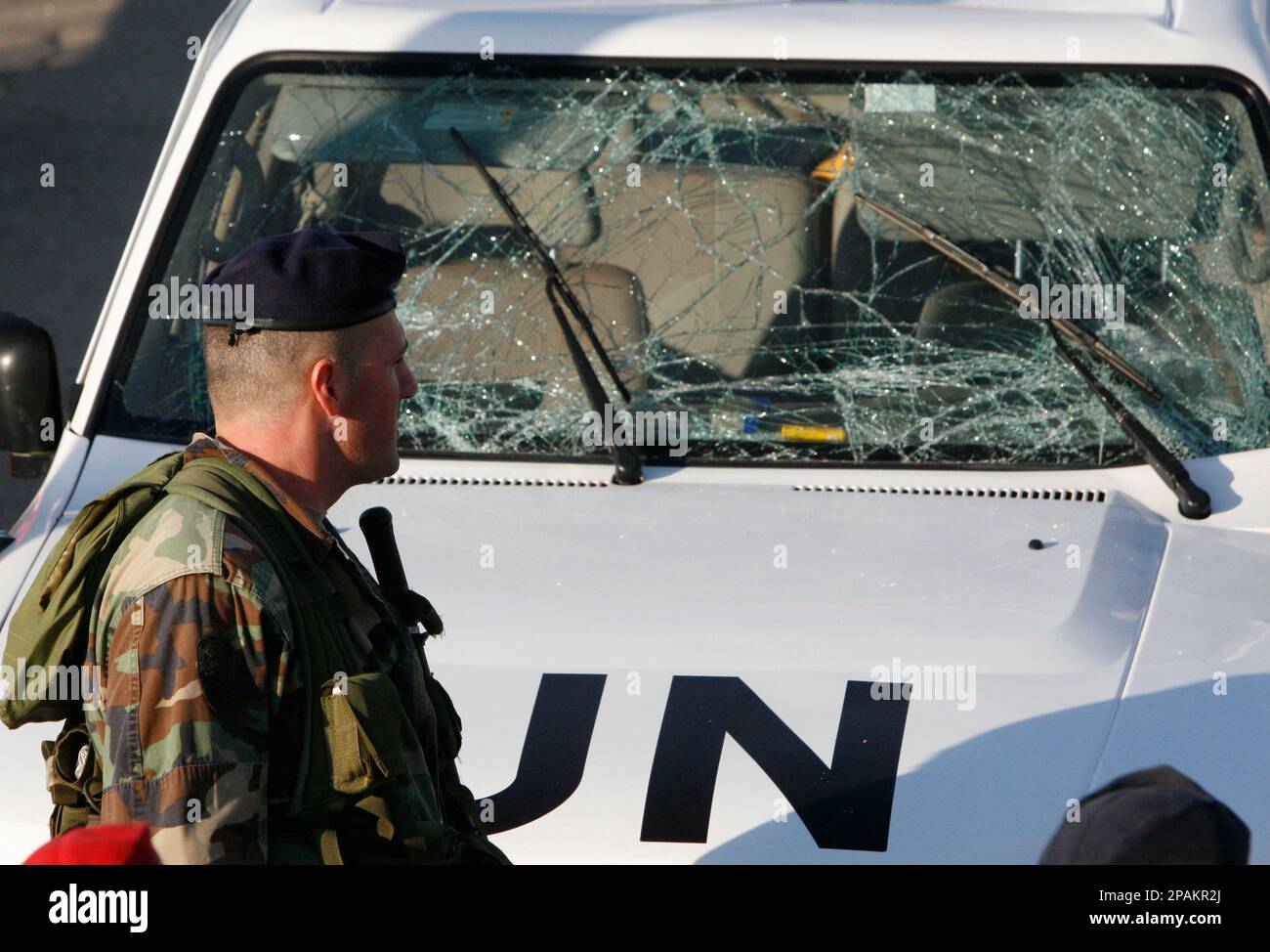 A Lebanese army soldier stand guards the damaged U.N peacekeeper ...