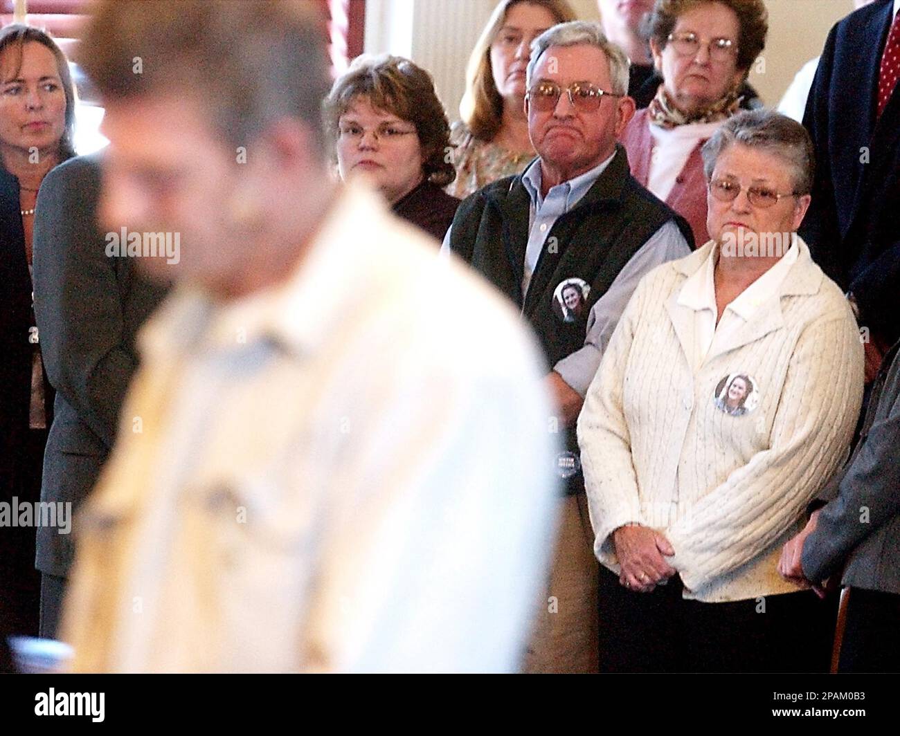 **FILE** David and Ann Scoville, right, watch the arraignment of Howard ...