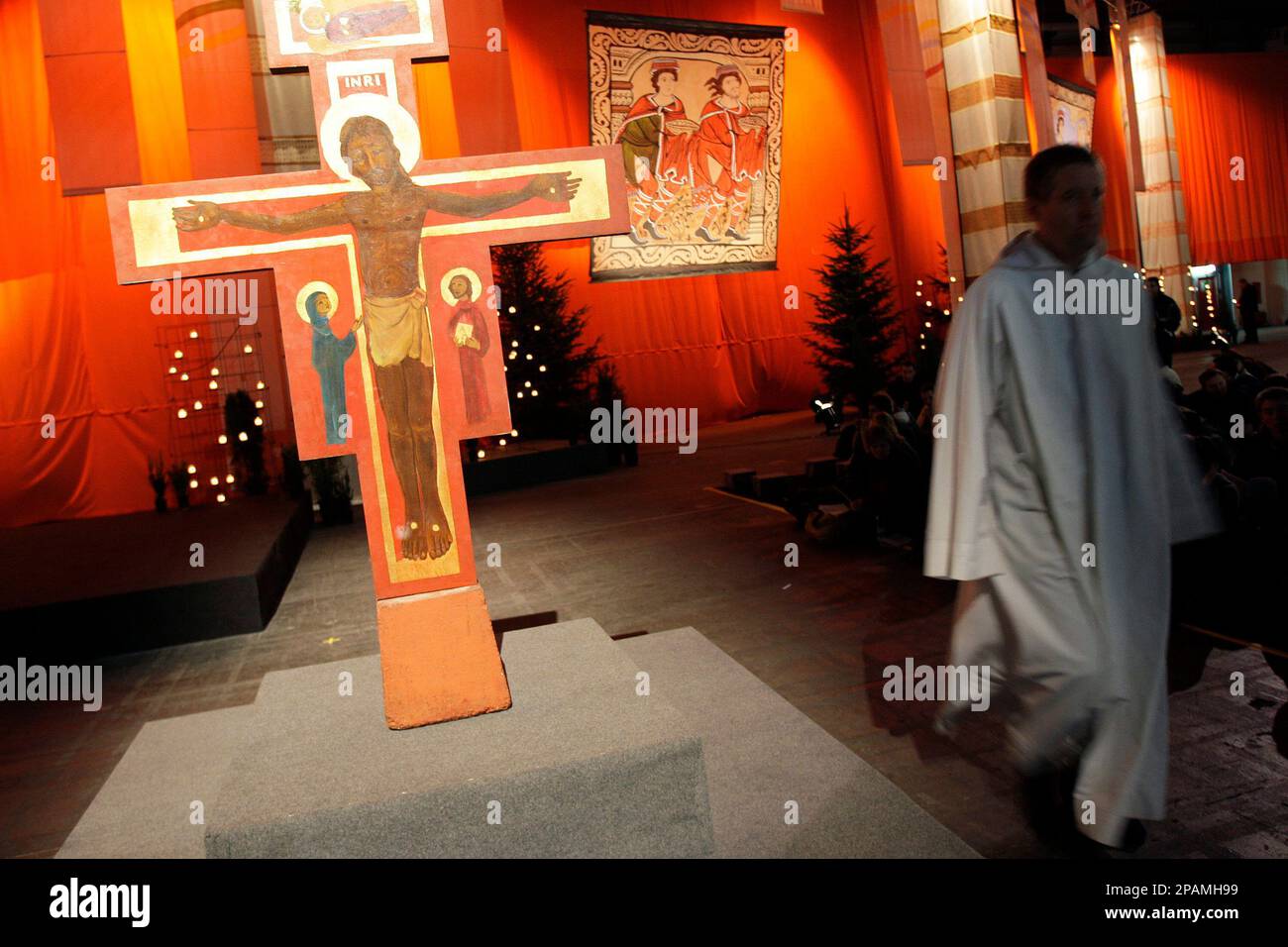 Brothers of the ecumenical community Taize wait before the start of a ...