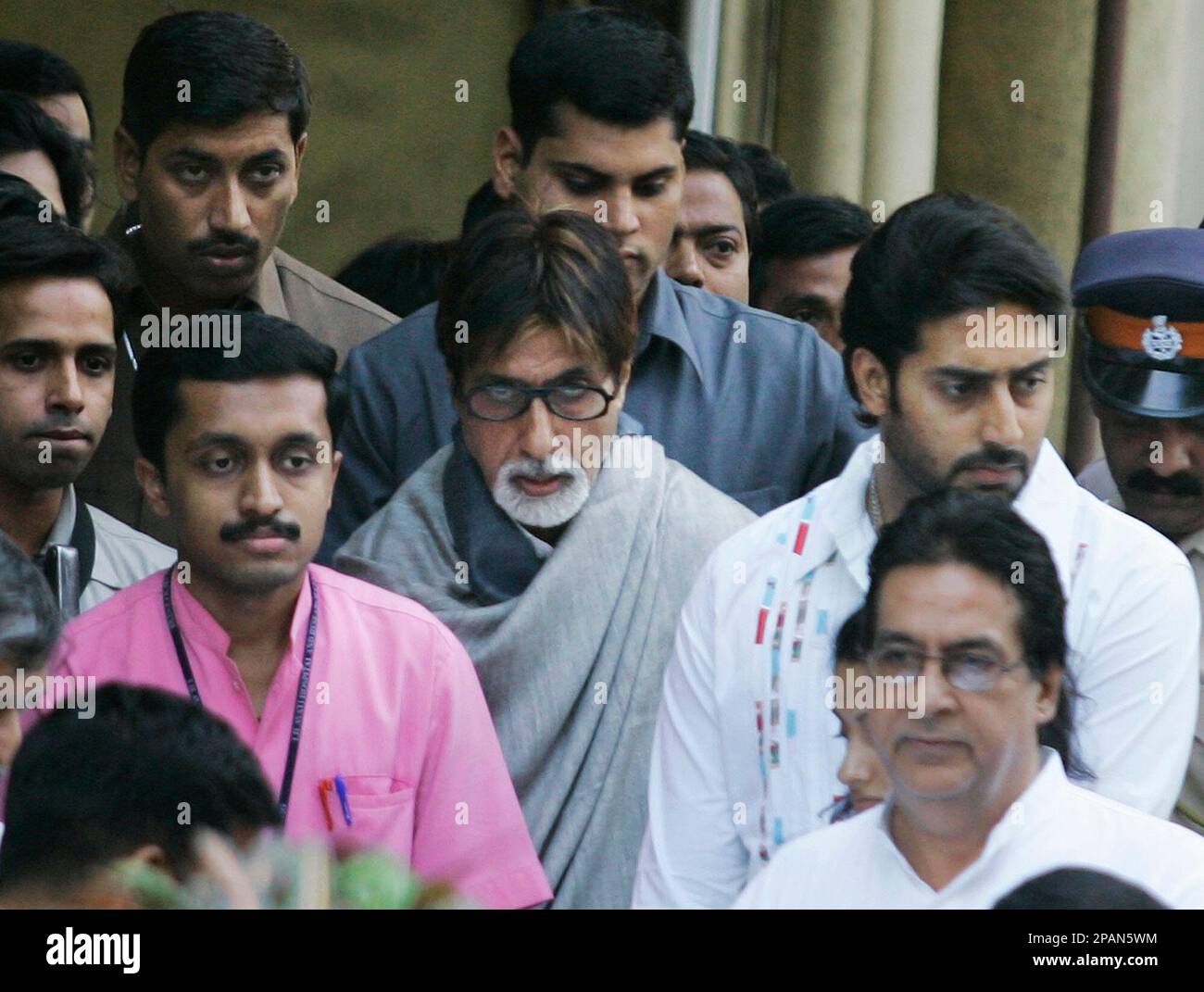 Bollywood actors Amitabh Bachchan, center, and his son Abhishek ...