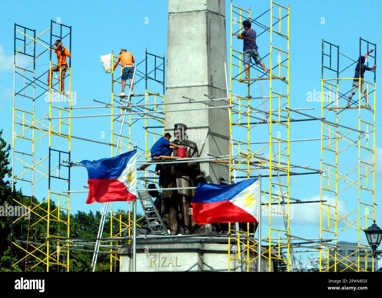 Workers spruce up the monument of Dr. Jose Rizal, the country's ...