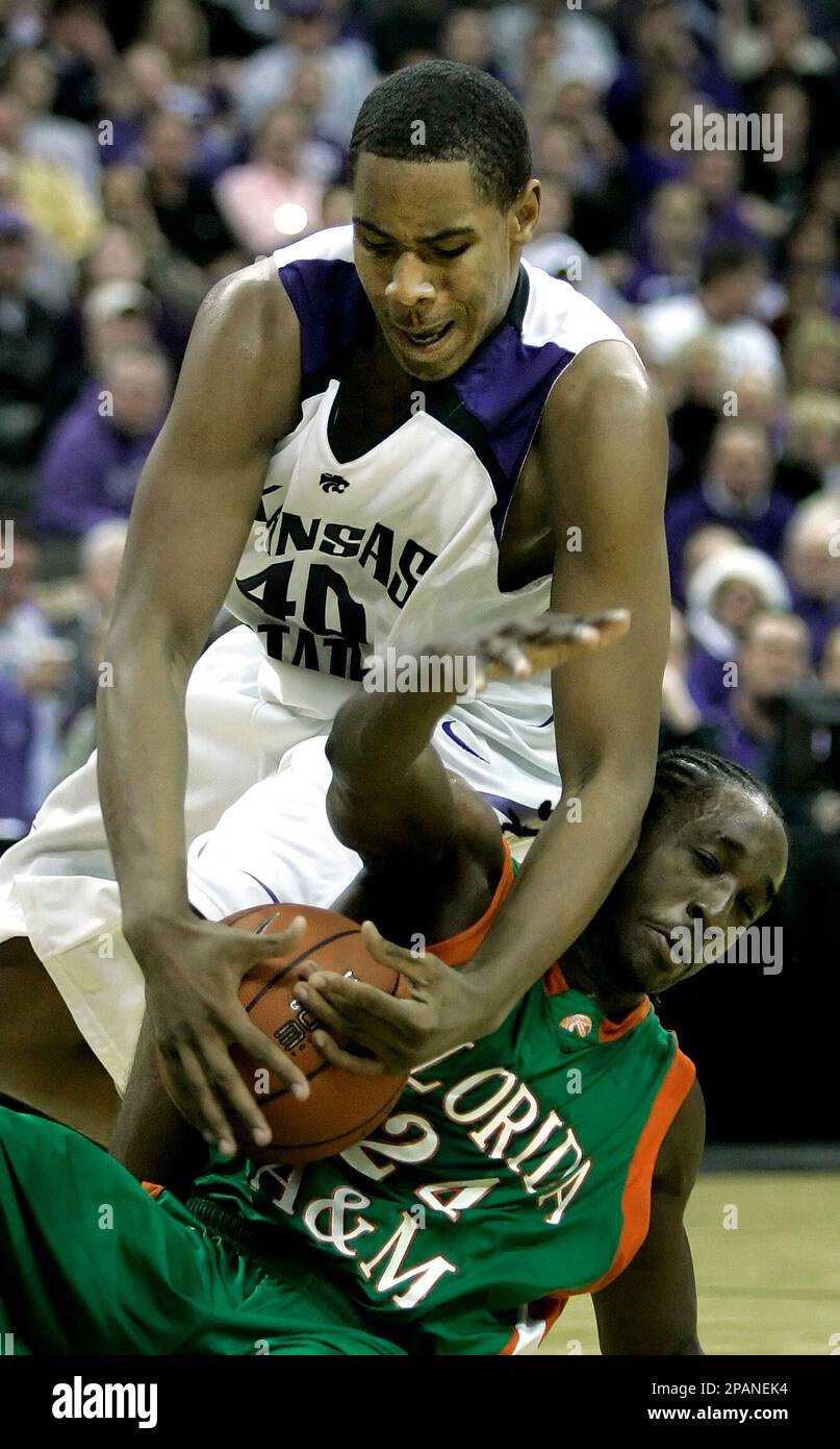 Kansas State forward Ron Anderson, top, attempts to steal the ball from ...