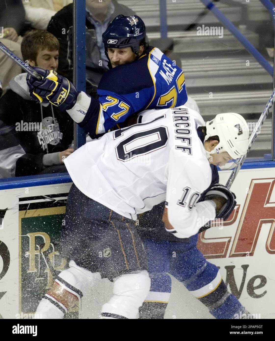 Edmonton Oilers' Shawn Horcoff, bottom, slams St. Louis Blues' Jay ...
