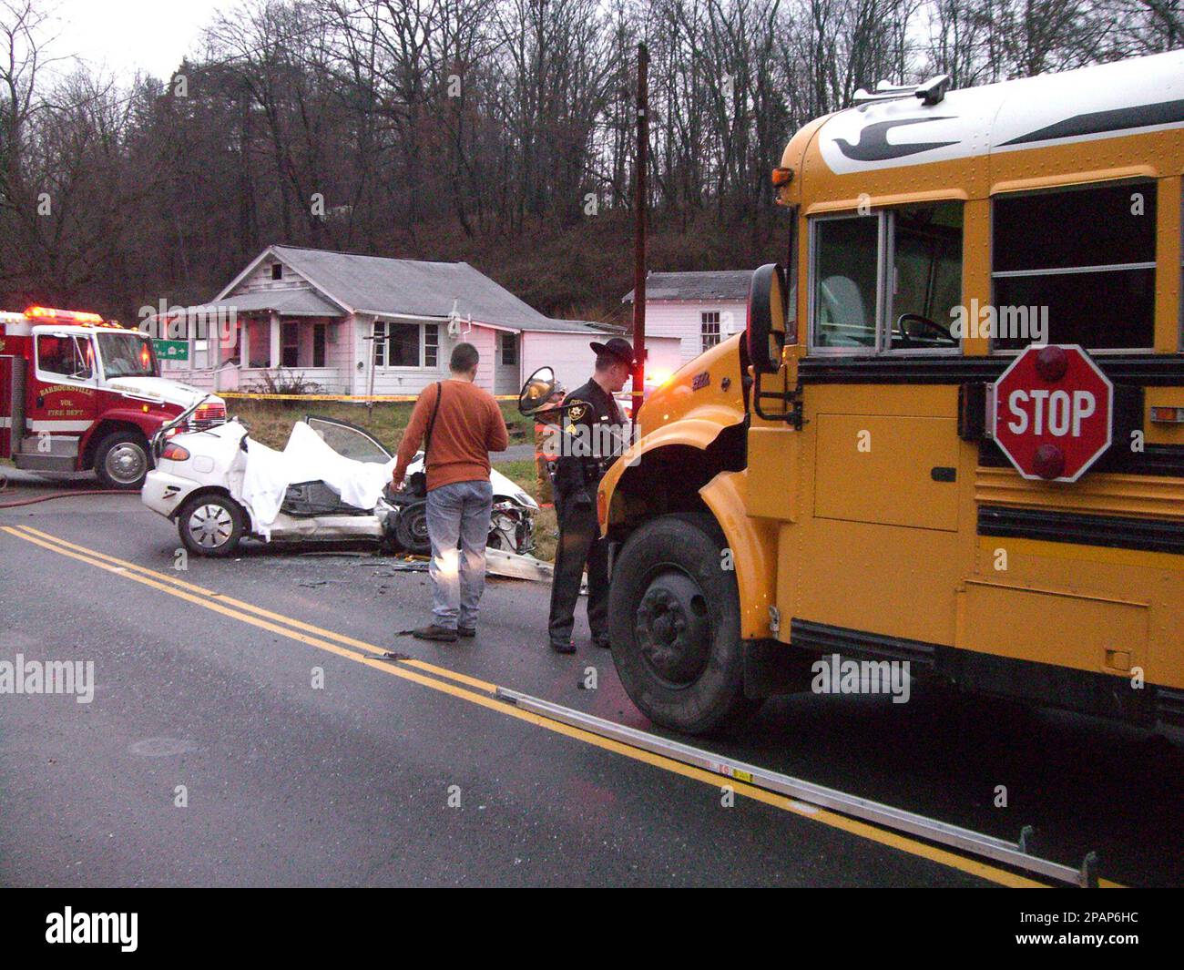 Emergency crews work on the scene of a fatal accident involving a ...