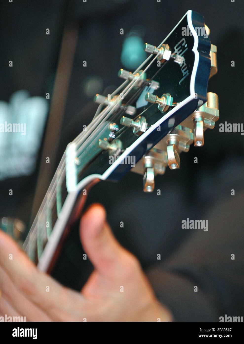 Pegs of Gibson's new product "Robot Guitar" are turned automatically as ...