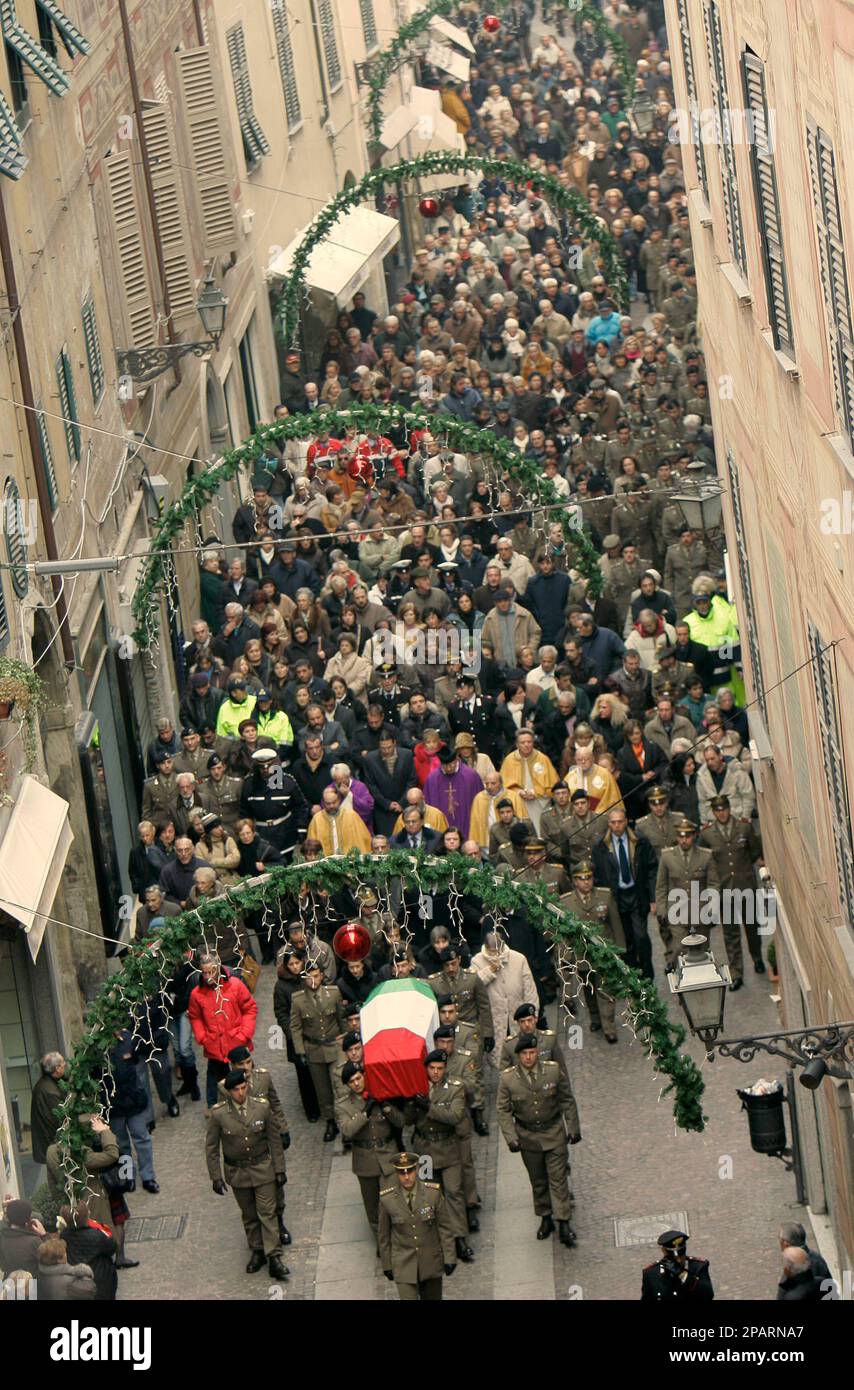 An Italian flag wraps the coffin of Daniele Paladini, the Italian ...