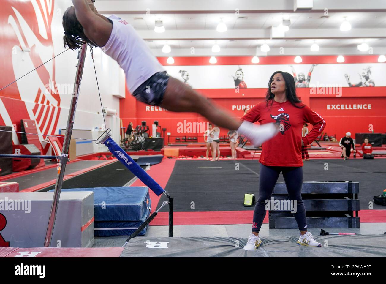 Rutgers women’s gymnastics coach Umme Salim-Beasley watches as student ...