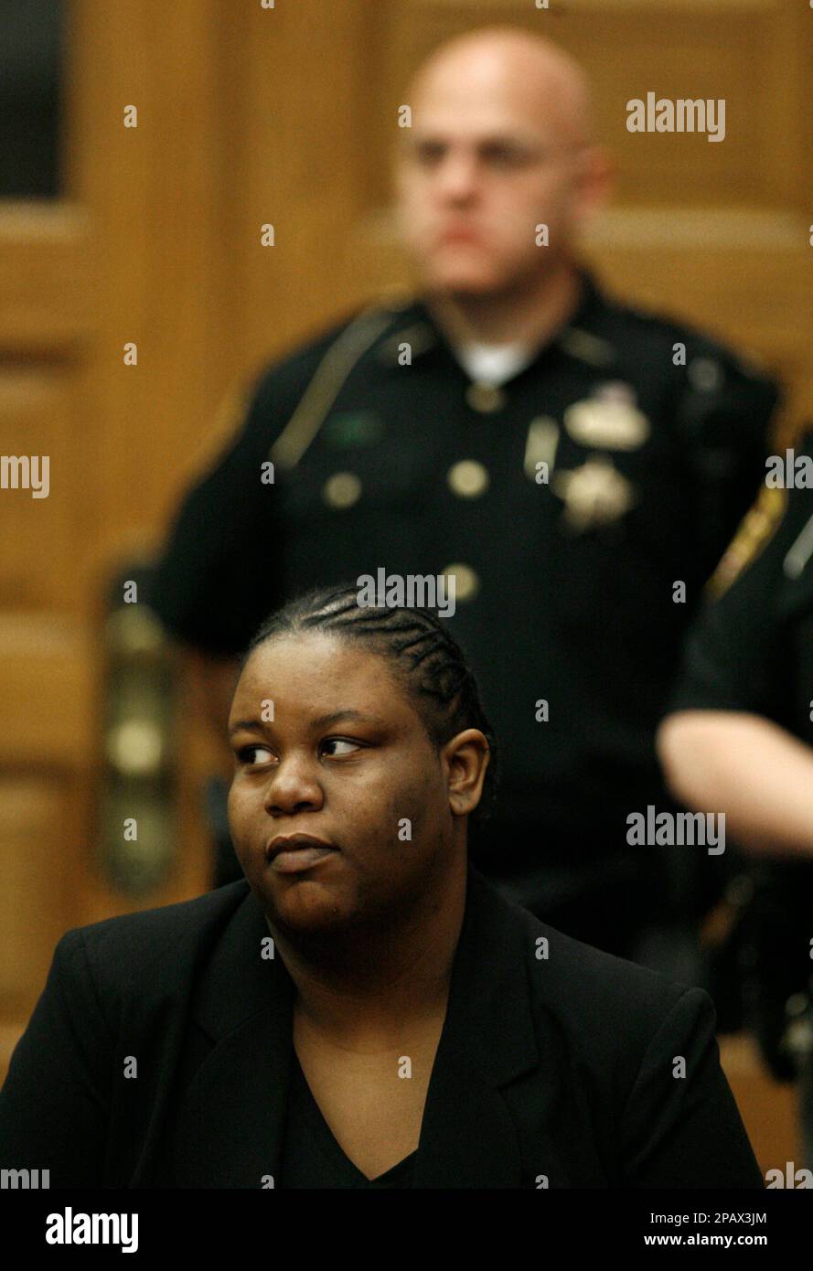 Myisha Ferrell listens during court proceedings before she pleads ...
