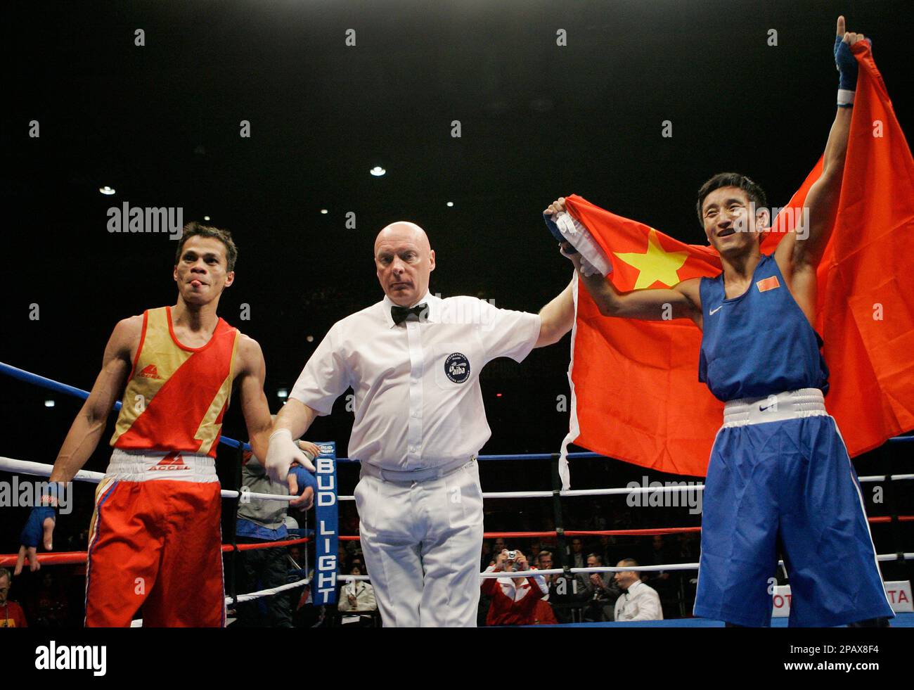 Shiming Zou, right, of China, celebrates his win over Harry Tanamor ...